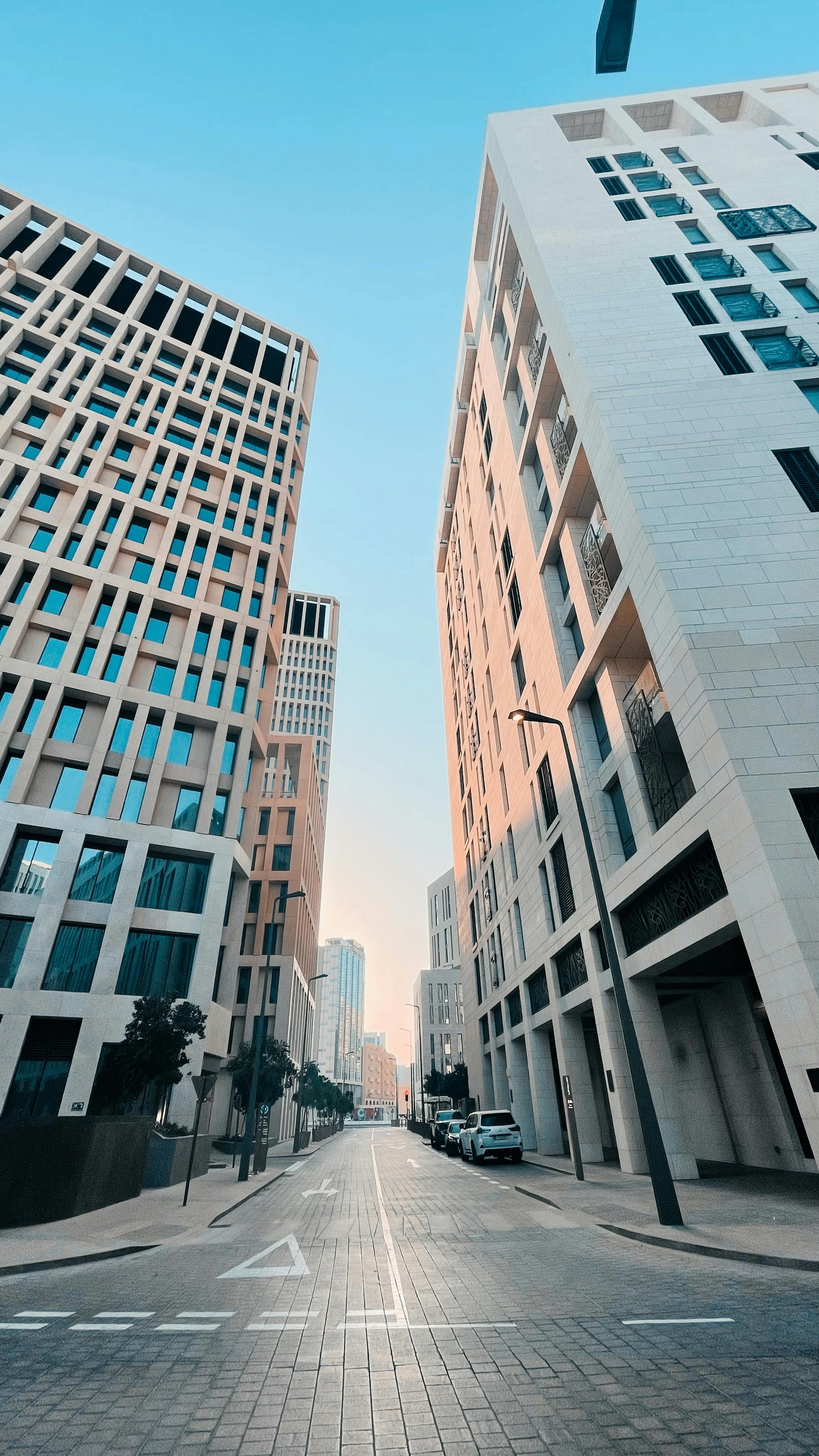 Modern Buildings by the Street in Sunlight · Free Stock Photo