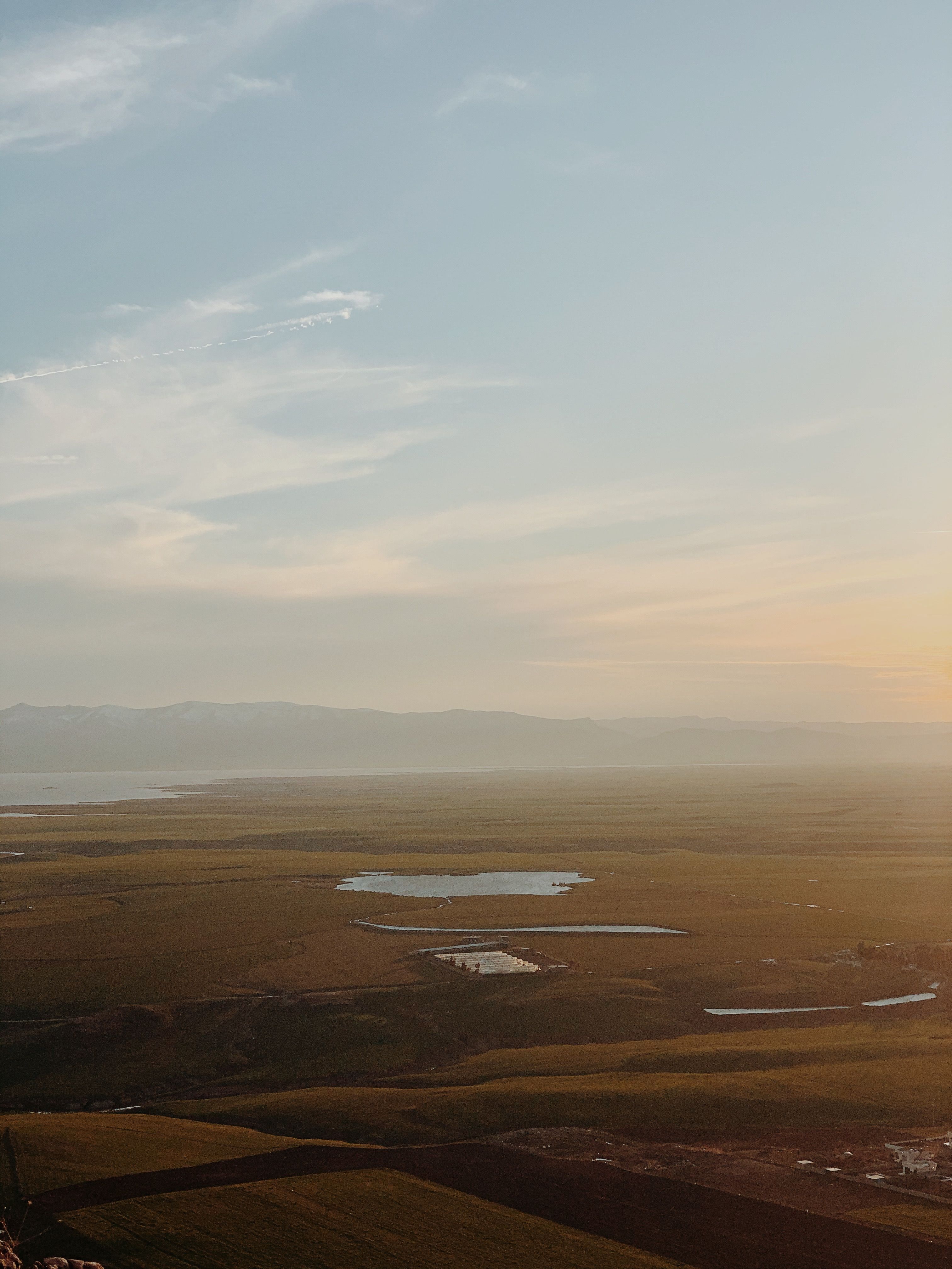 Aerial View of Open Plains under Clear Sky · Free Stock Photo