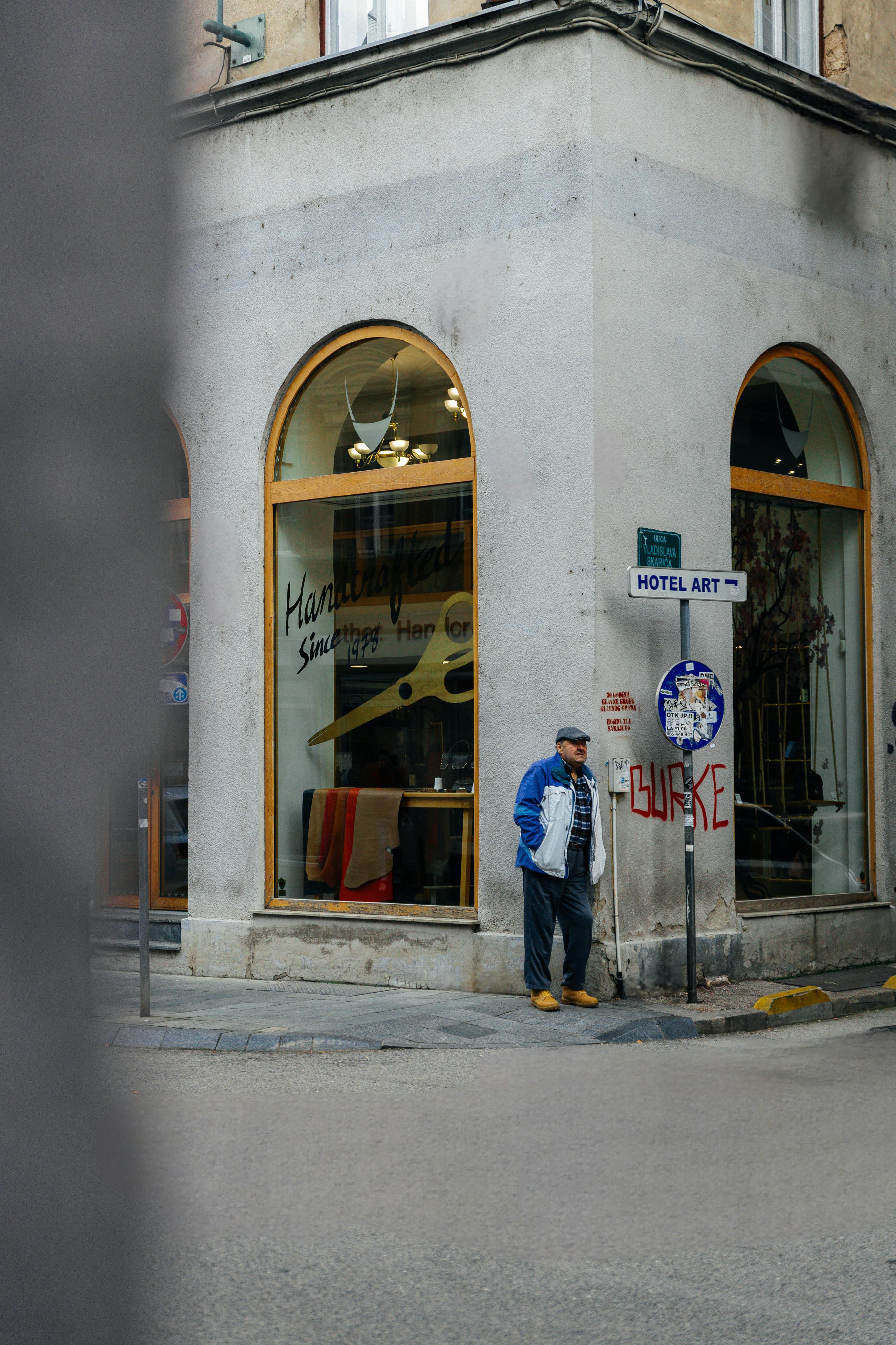 Man Standing on Street Corner · Free Stock Photo