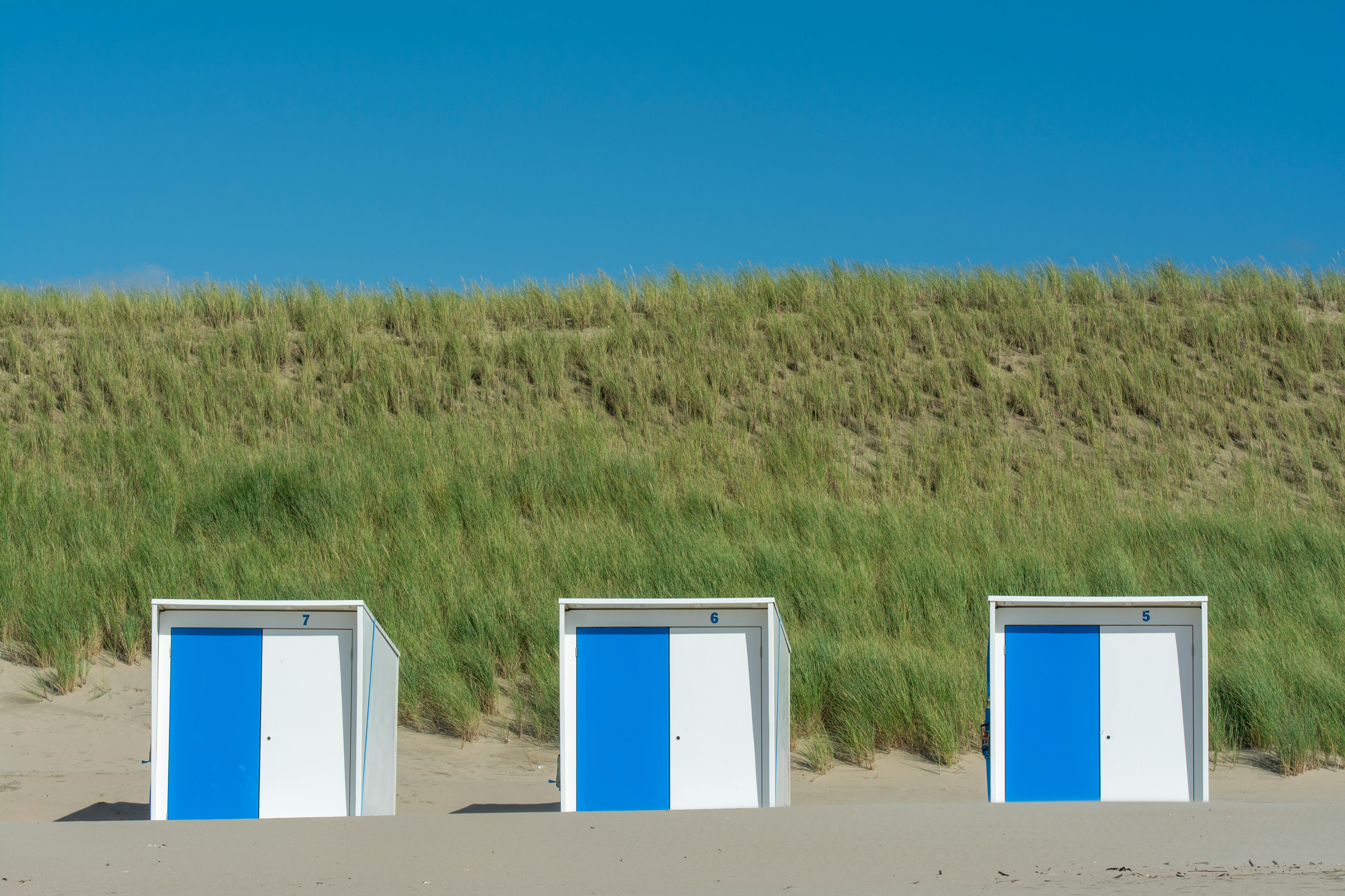 White and Blue Changing Rooms on the Beach · Free Stock Photo