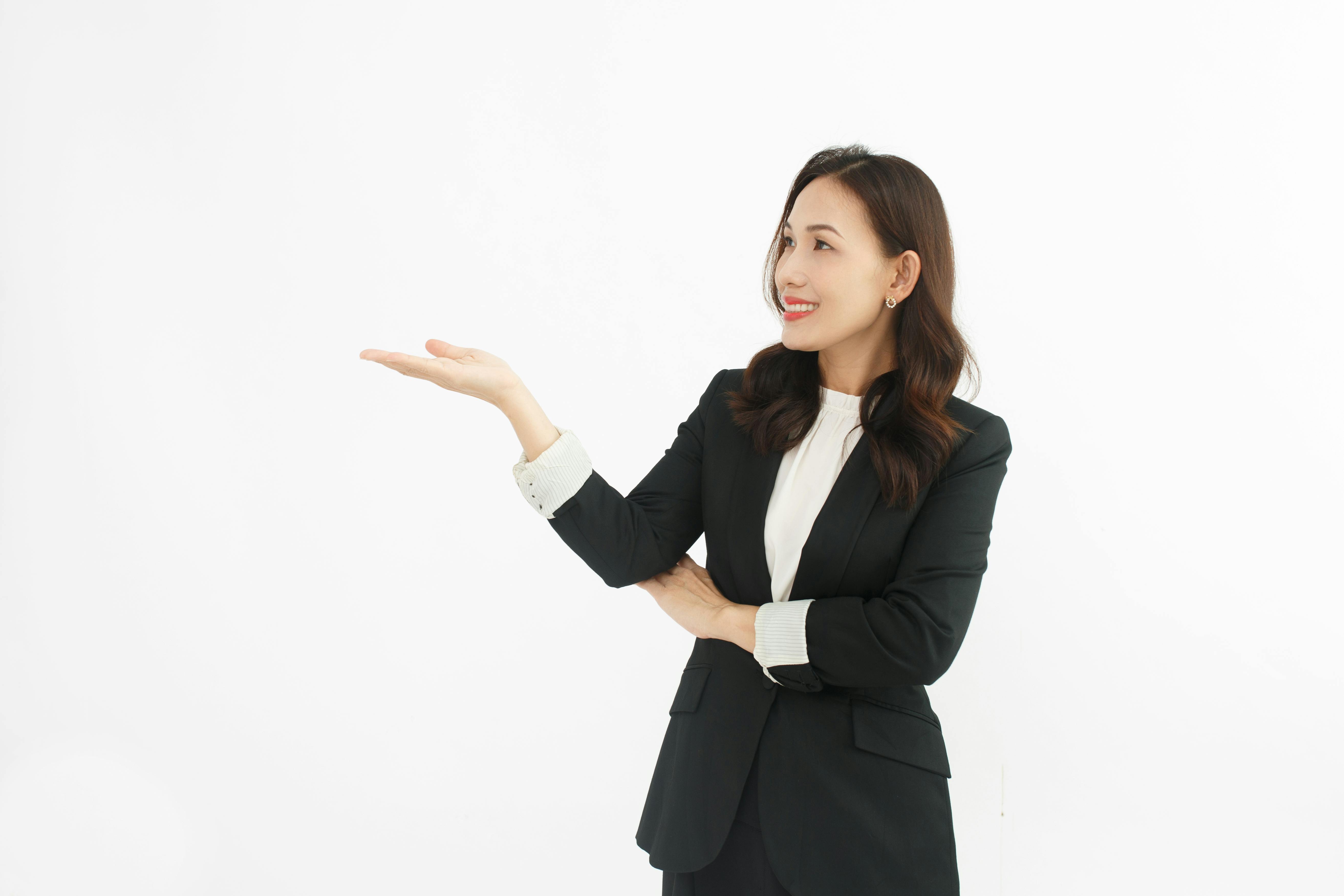 Smiling Businesswoman against White Background · Free Stock Photo