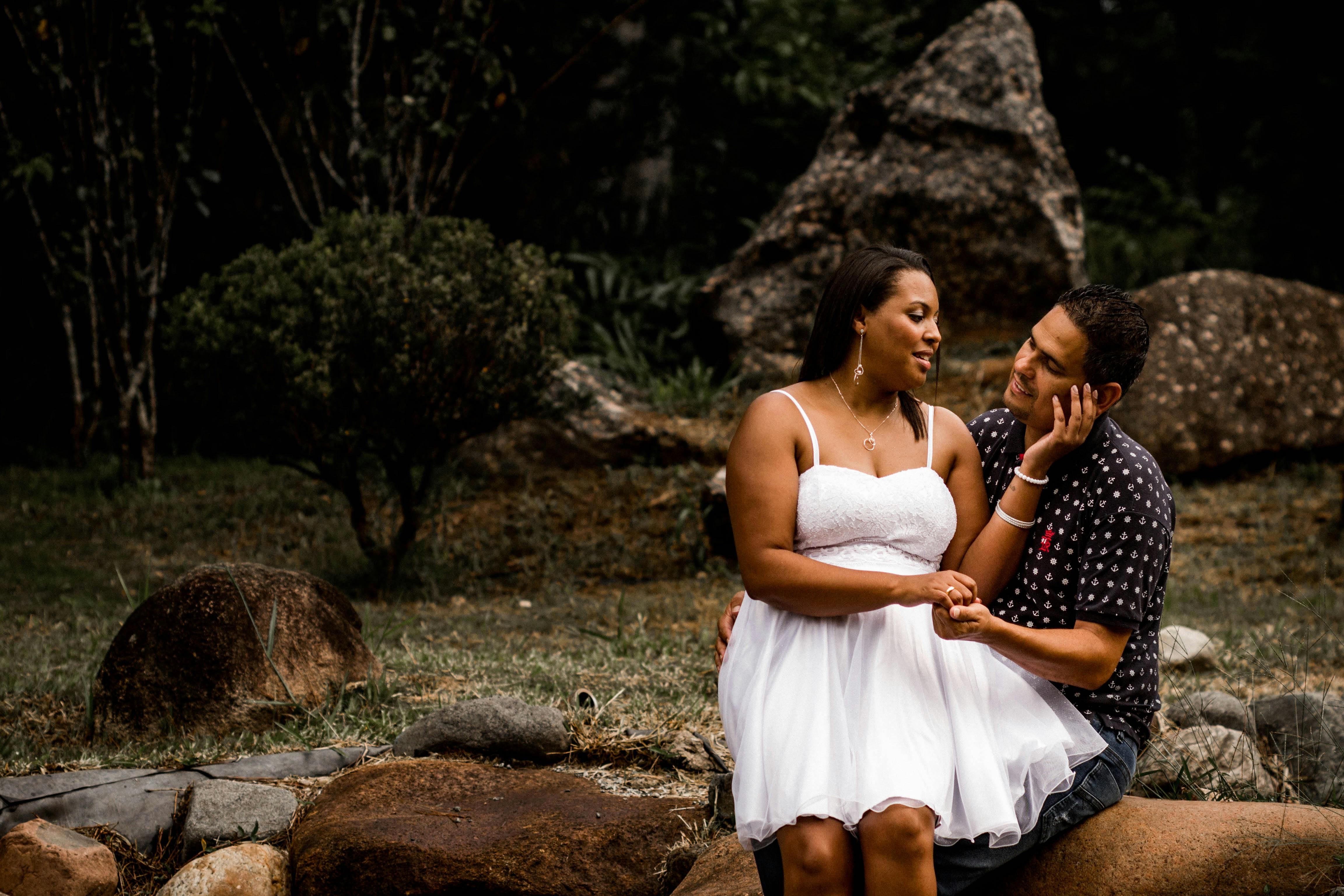 A Smiling Woman Sitting on the Man's Lap · Free Stock Photo