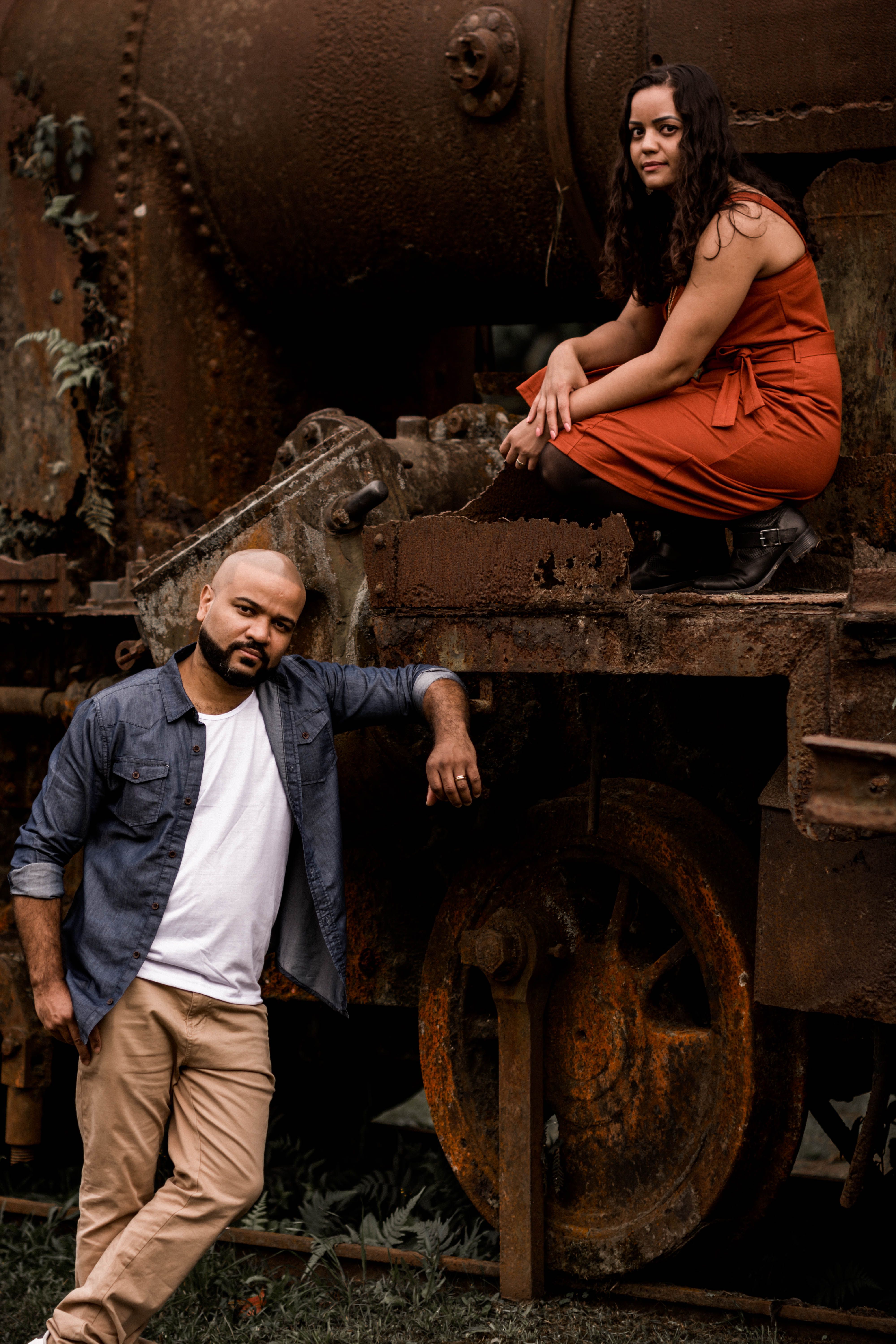 Couple Posing on a Rusty Vehicle · Free Stock Photo