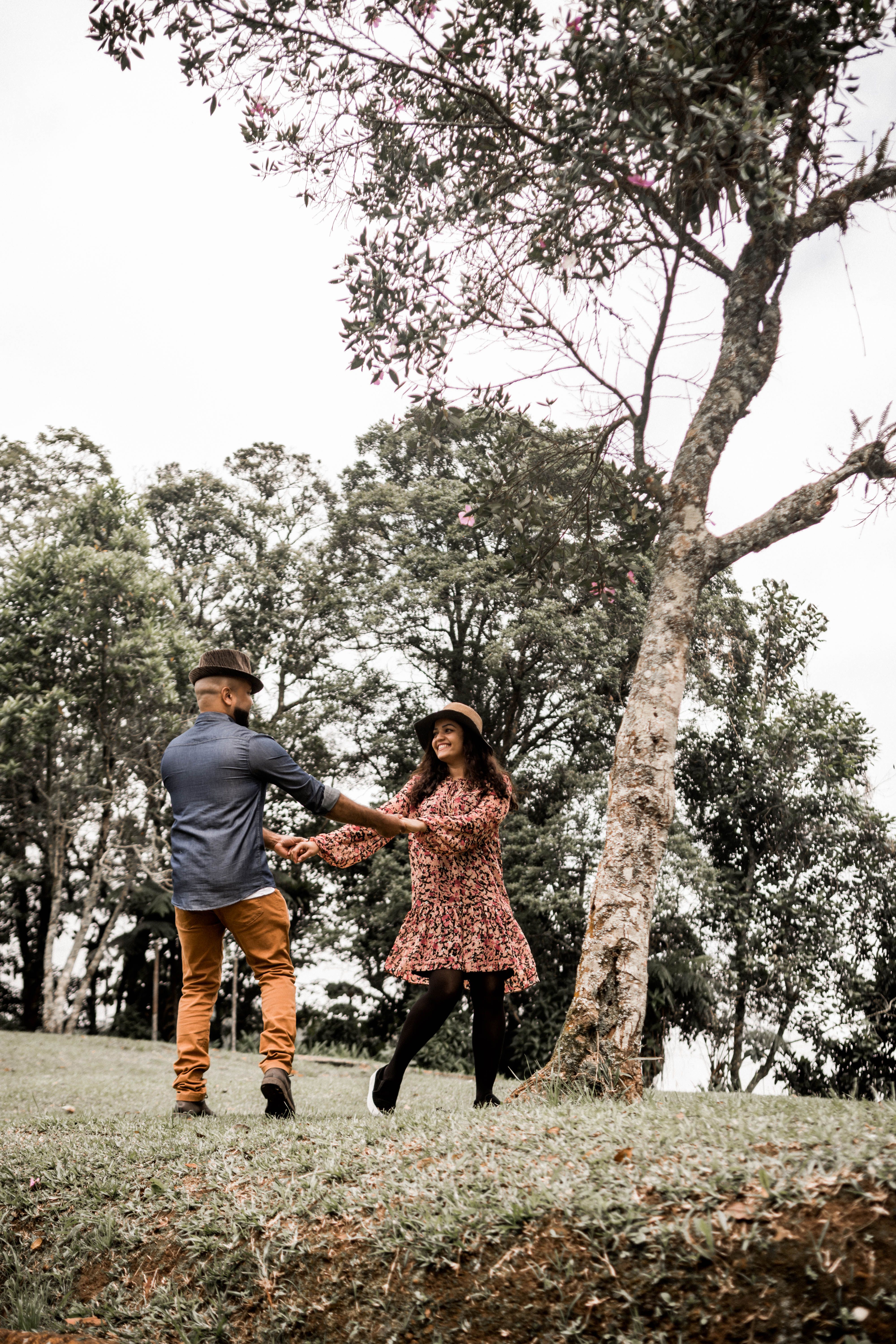 Low Angle Shot of a Couple Dancing Outside · Free Stock Photo