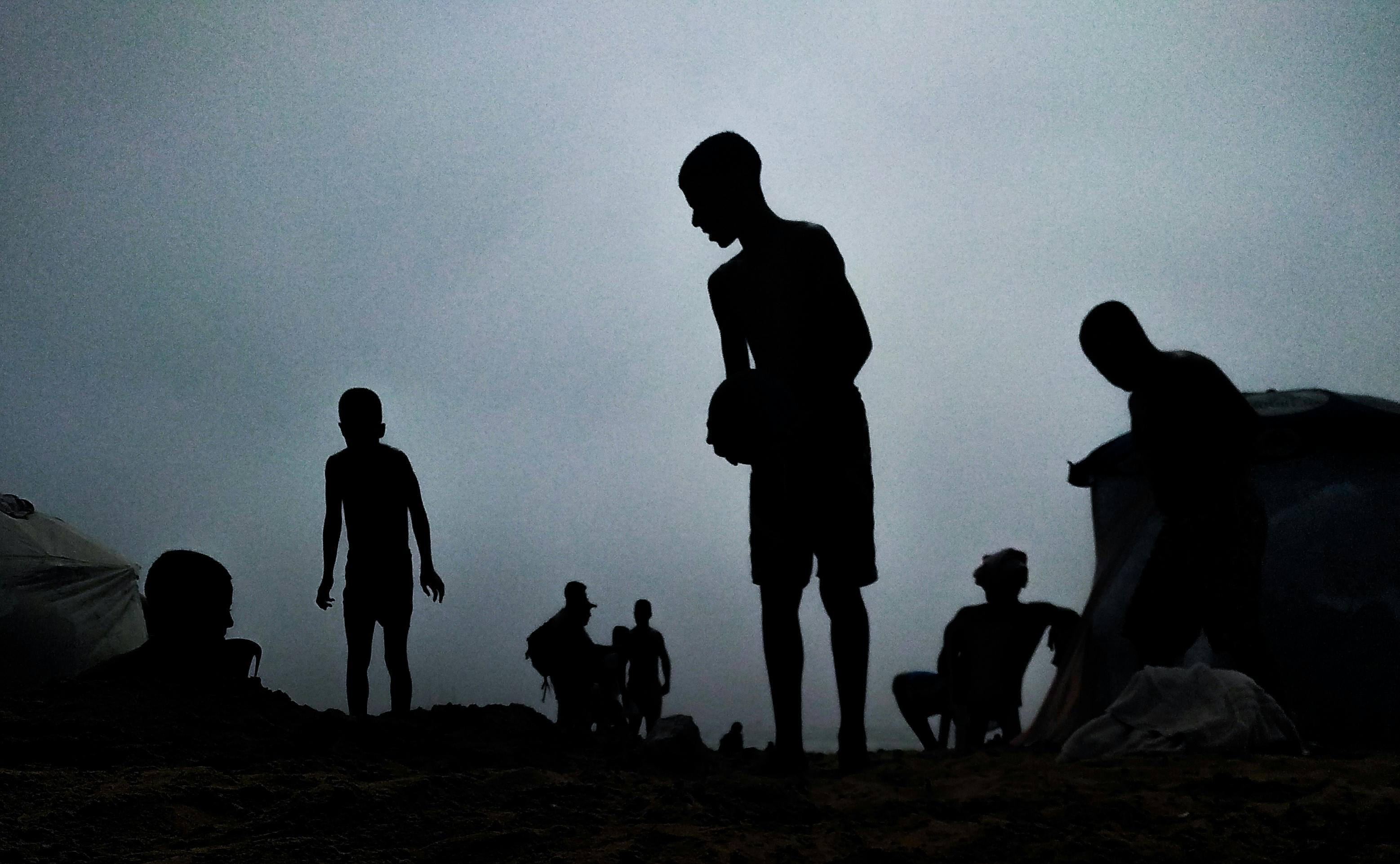 Back View of a Silhouetted Crowd at Sunset · Free Stock Photo