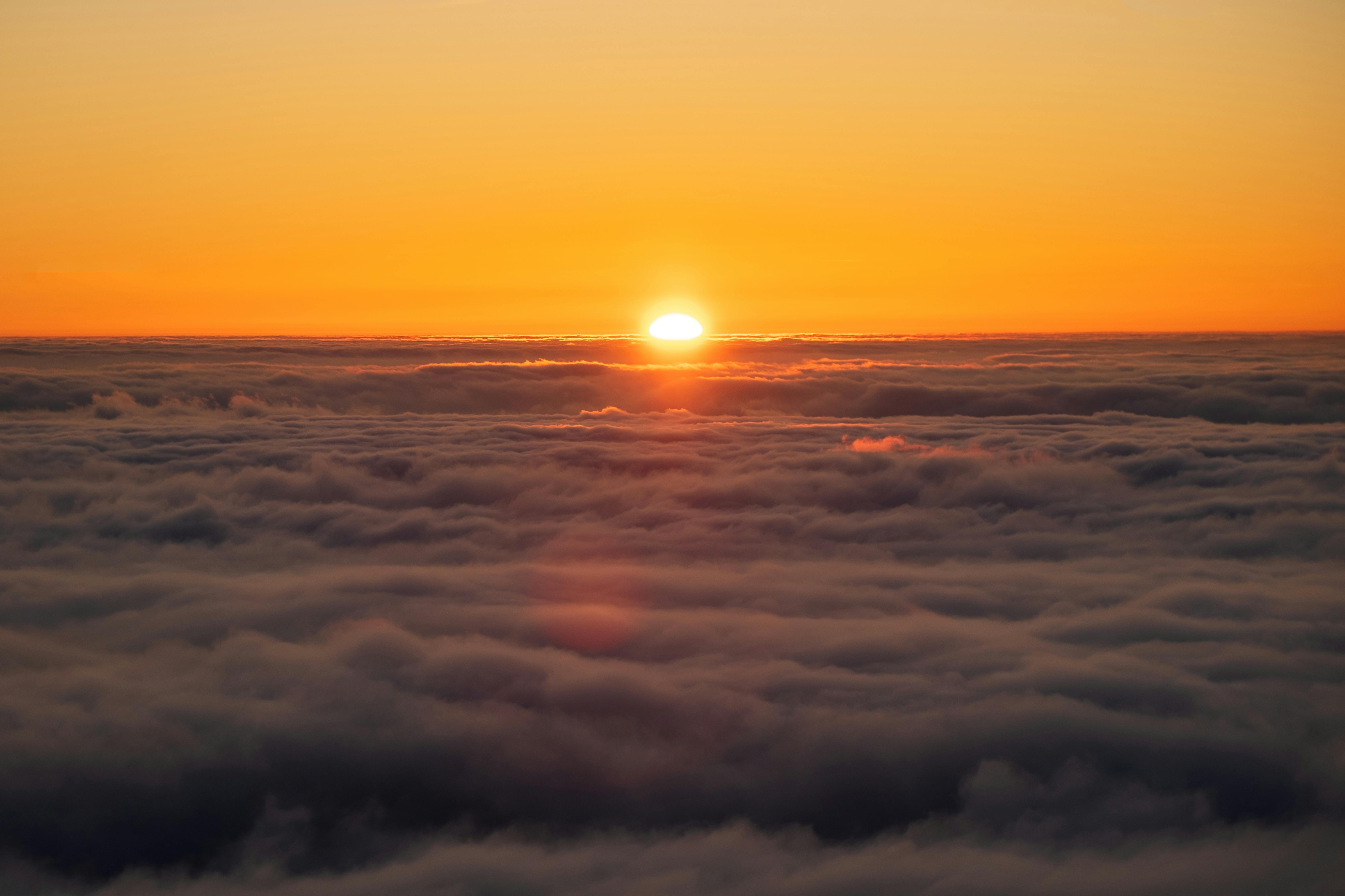 Sun Rising Above the Cloud Cover · Free Stock Photo