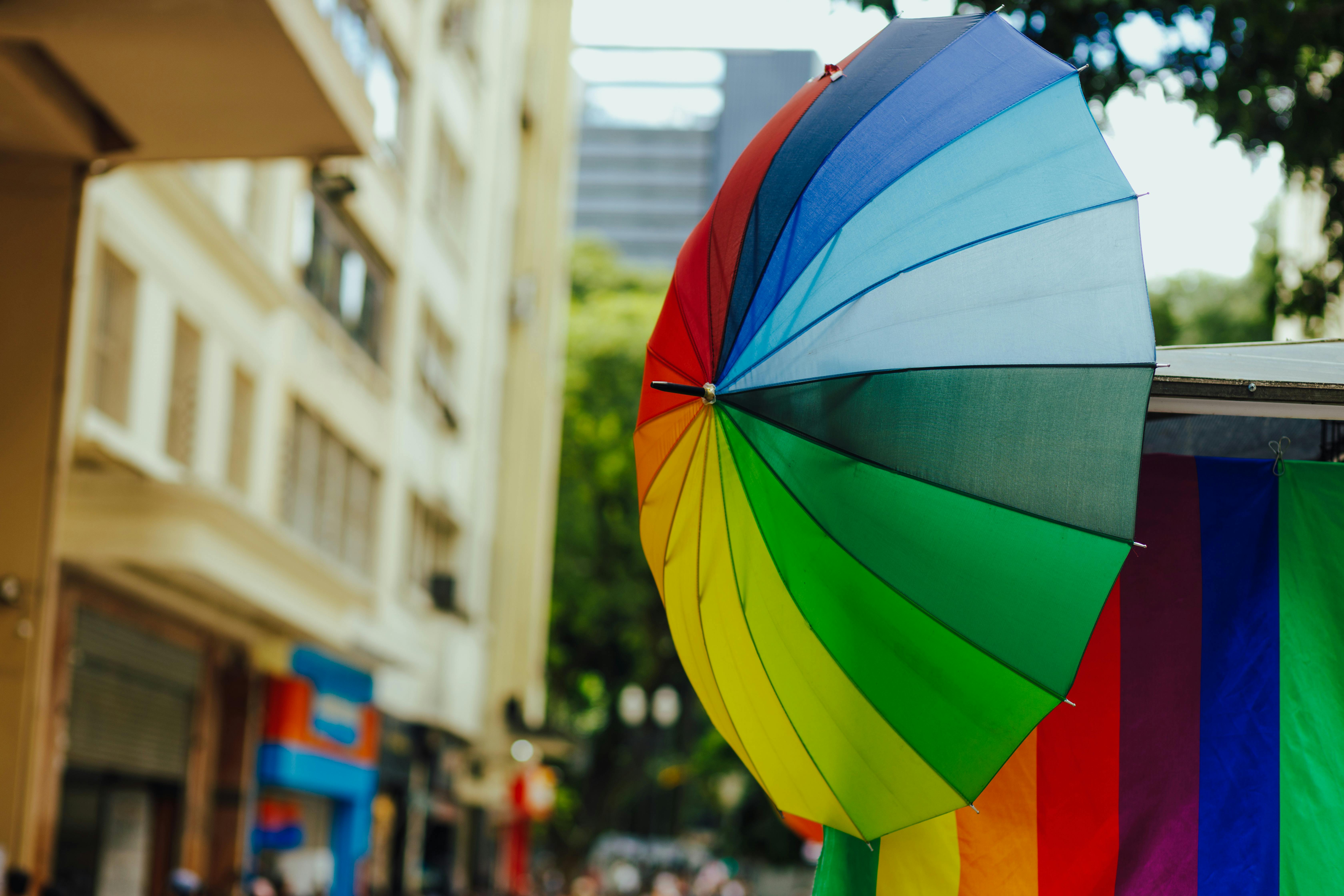 Colorful Umbrella on Building Roof on City Street · Free Stock Photo