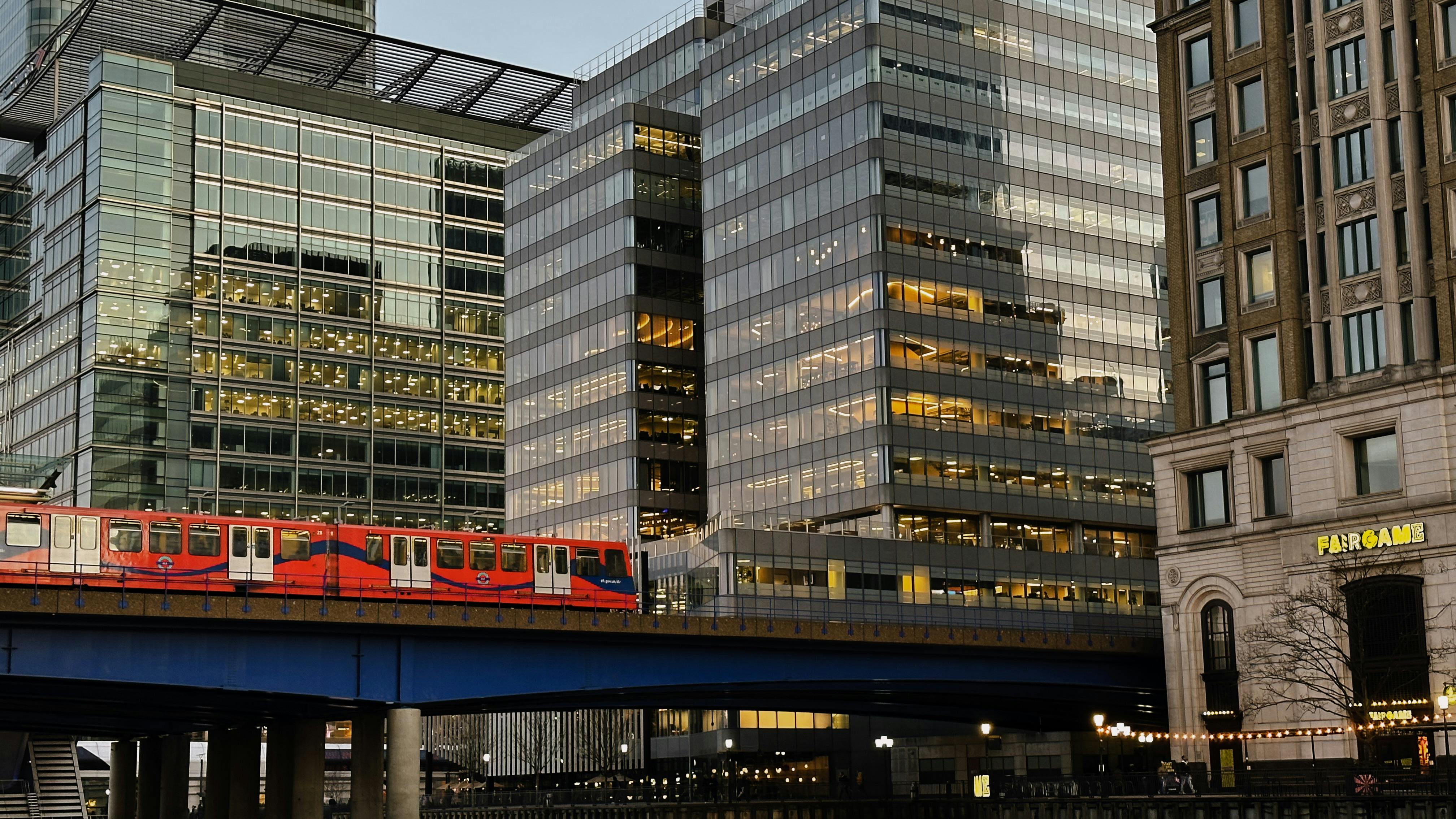 A Train Passing in front of Modern Office Buildings in City · Free ...