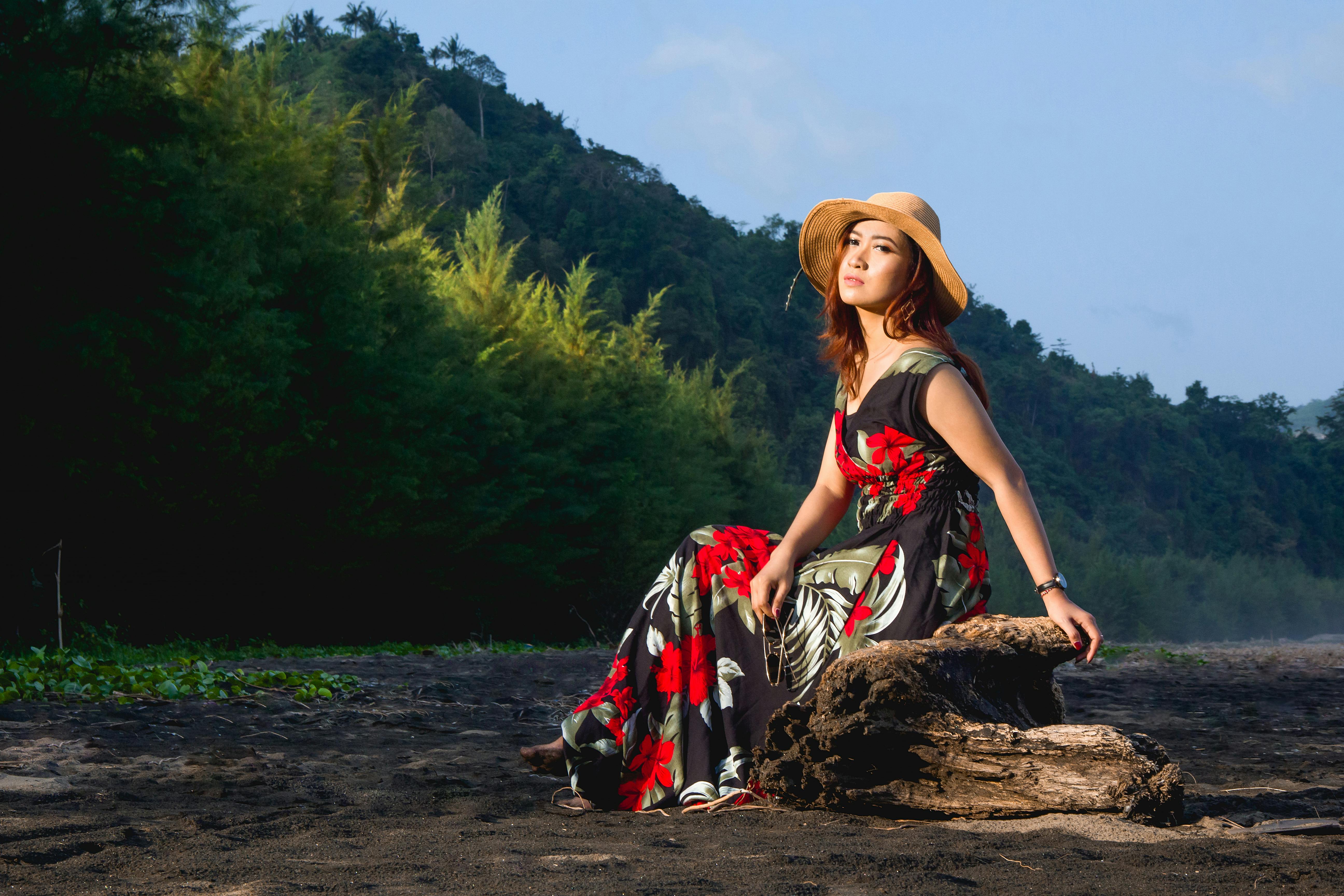 Woman Sitting on Rock in Forest · Free Stock Photo