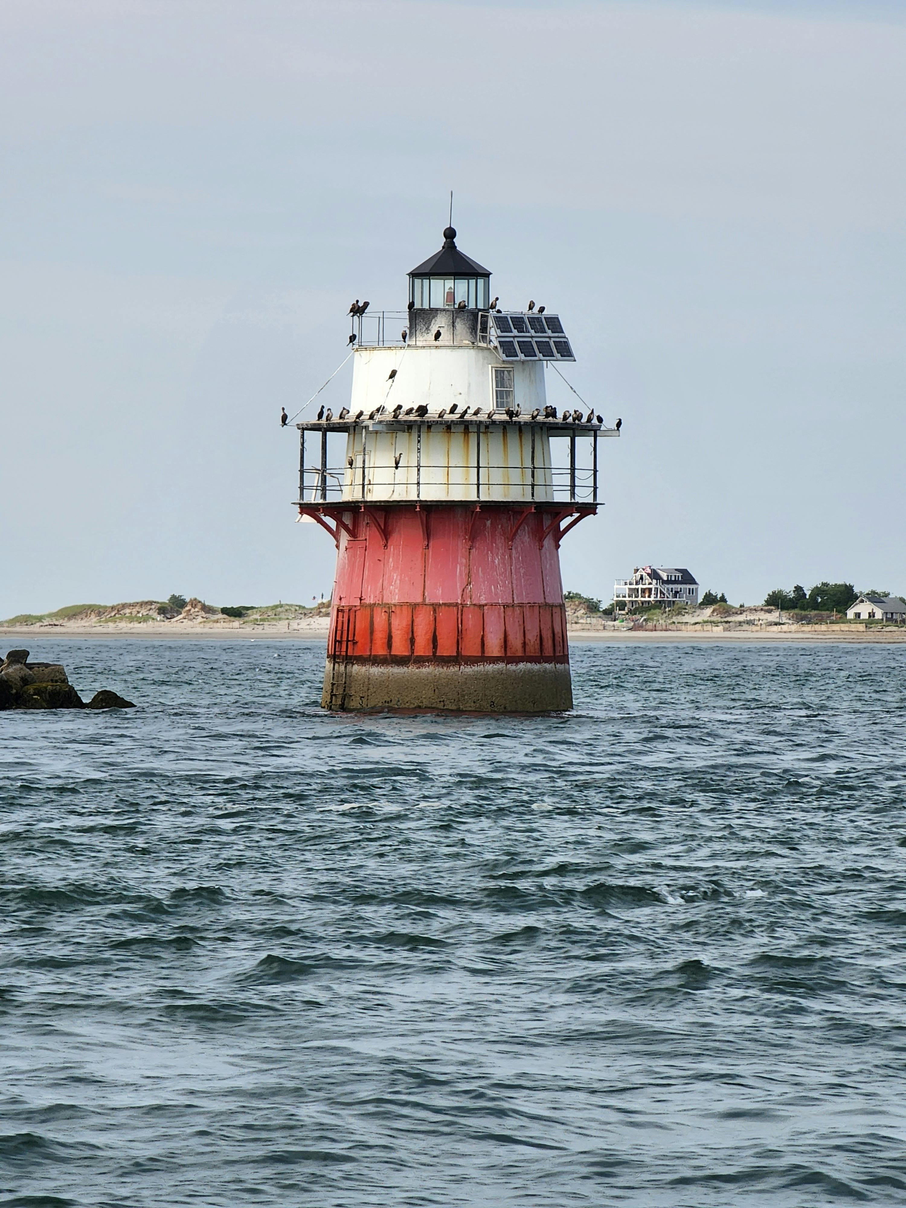 Lighthouse in Sea Water · Free Stock Photo