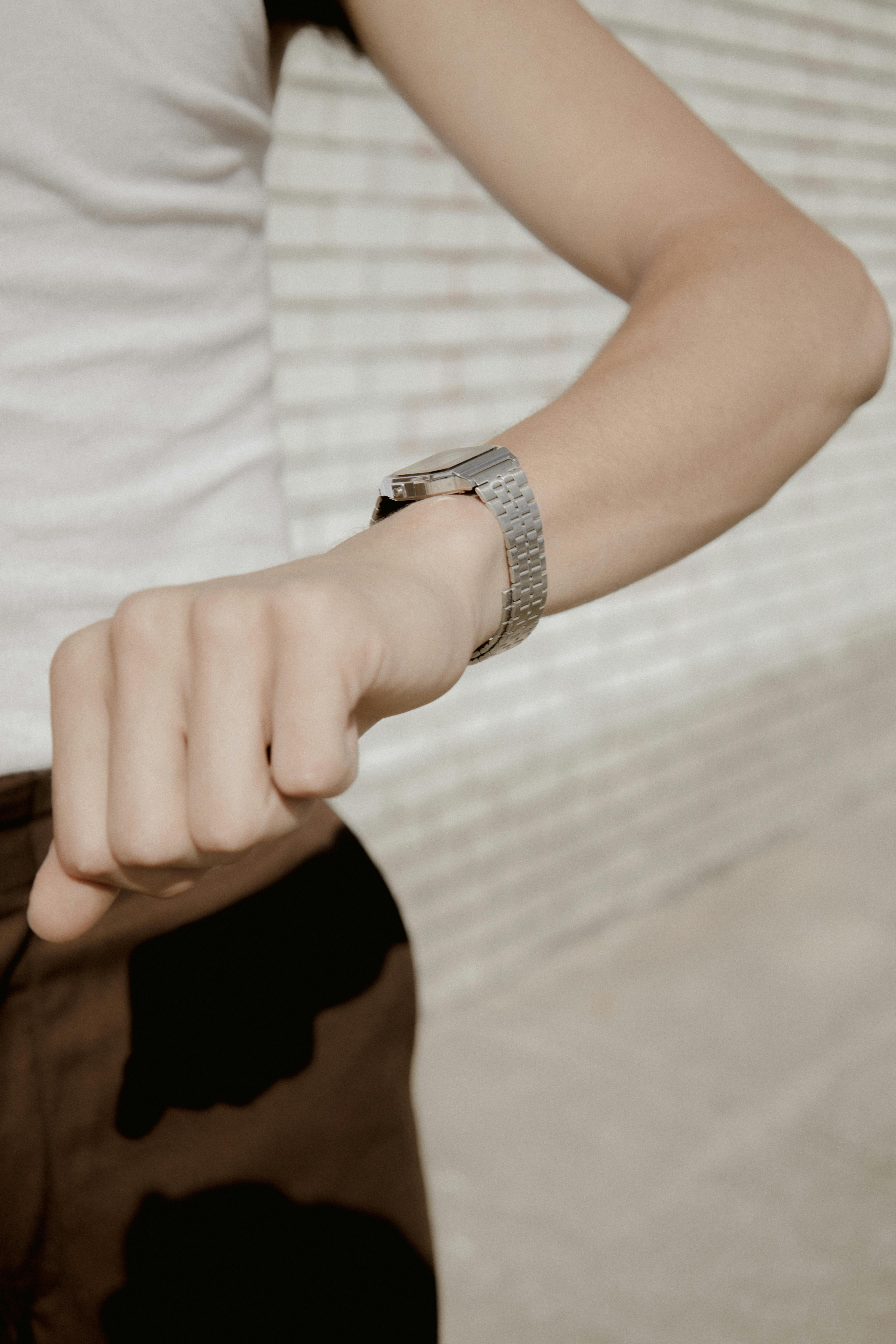 A person wearing a watch on their wrist · Free Stock Photo
