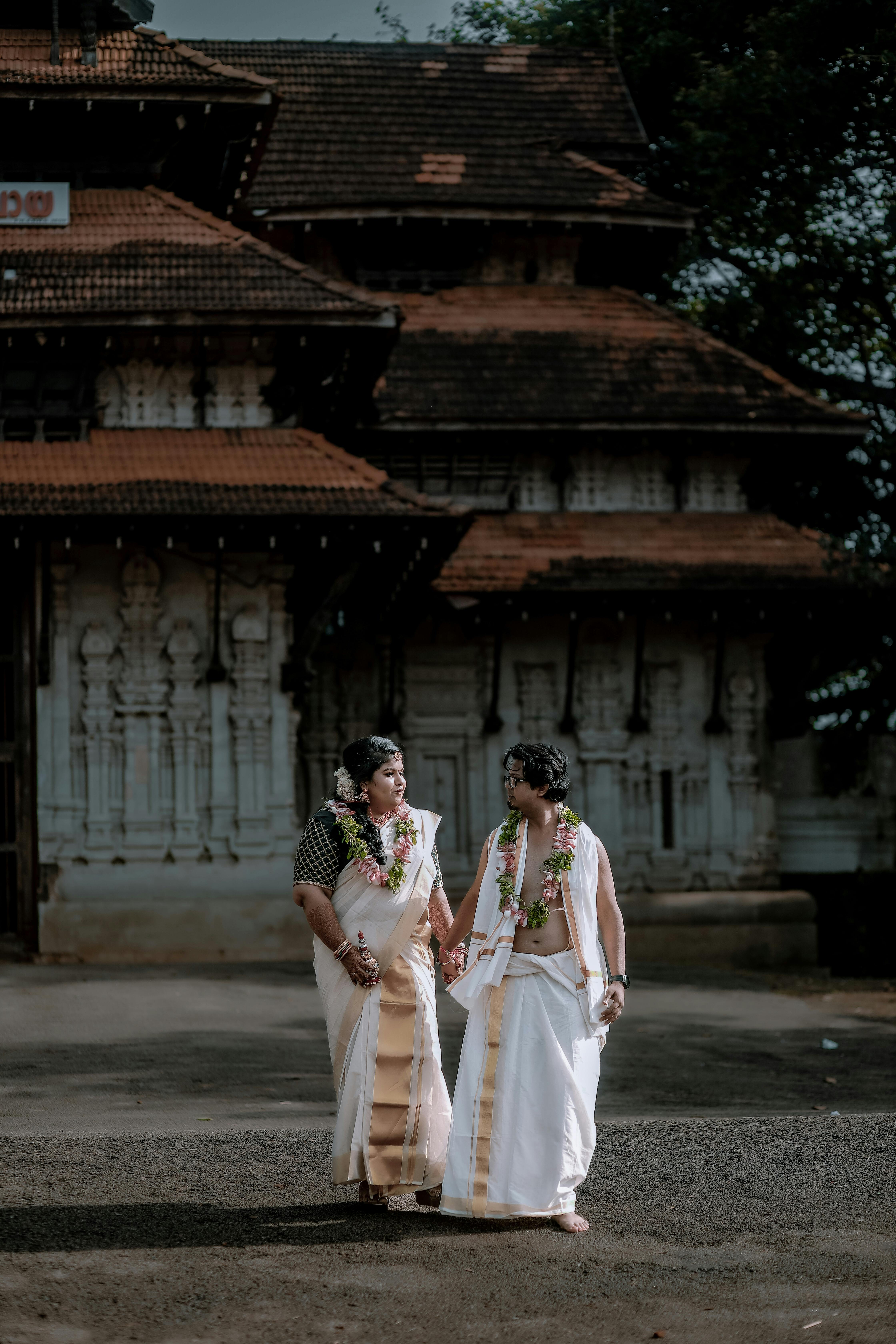 Woman and Man Posing Together in Traditional Clothing · Free Stock Photo