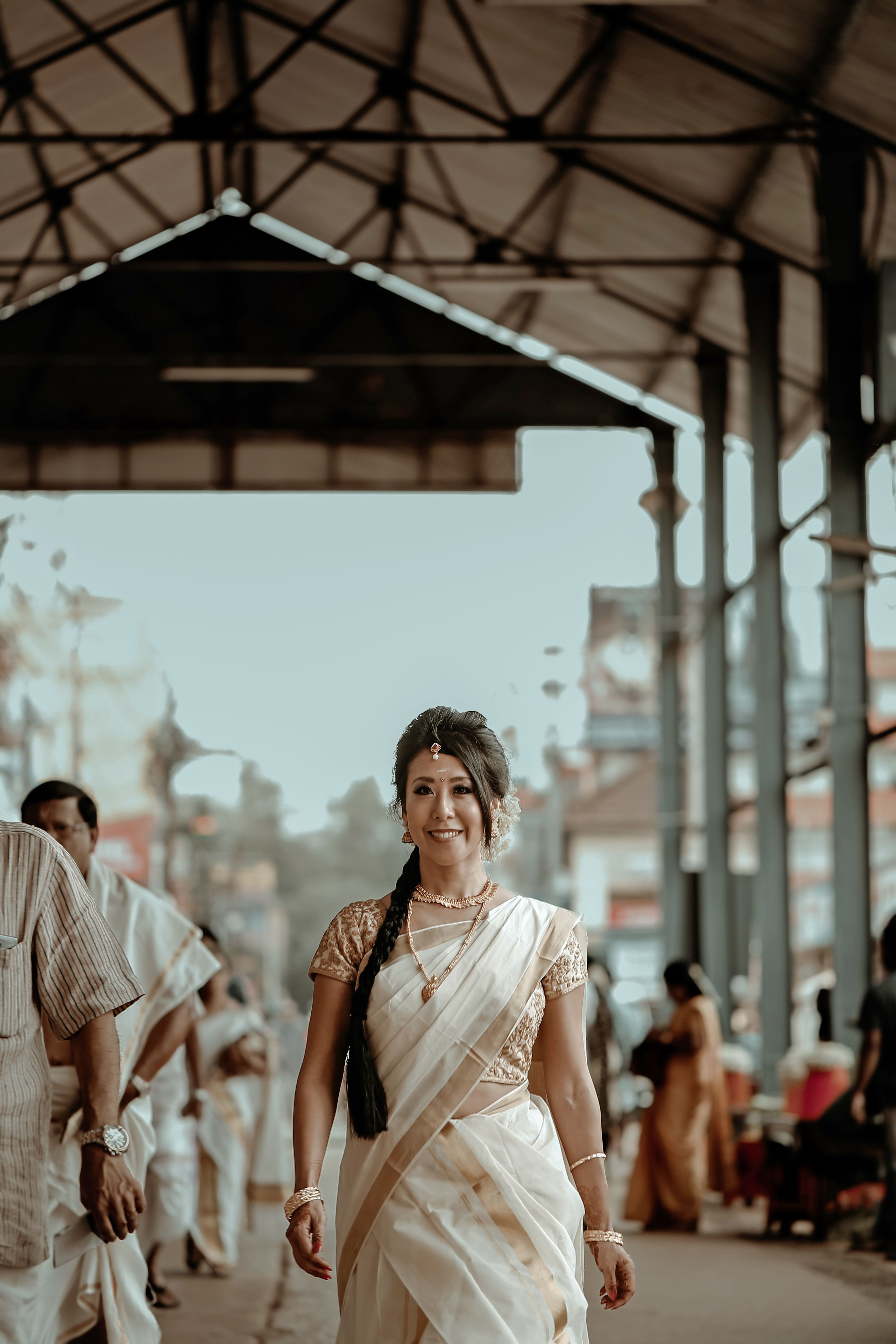 Woman Walking in Traditional Clothing · Free Stock Photo