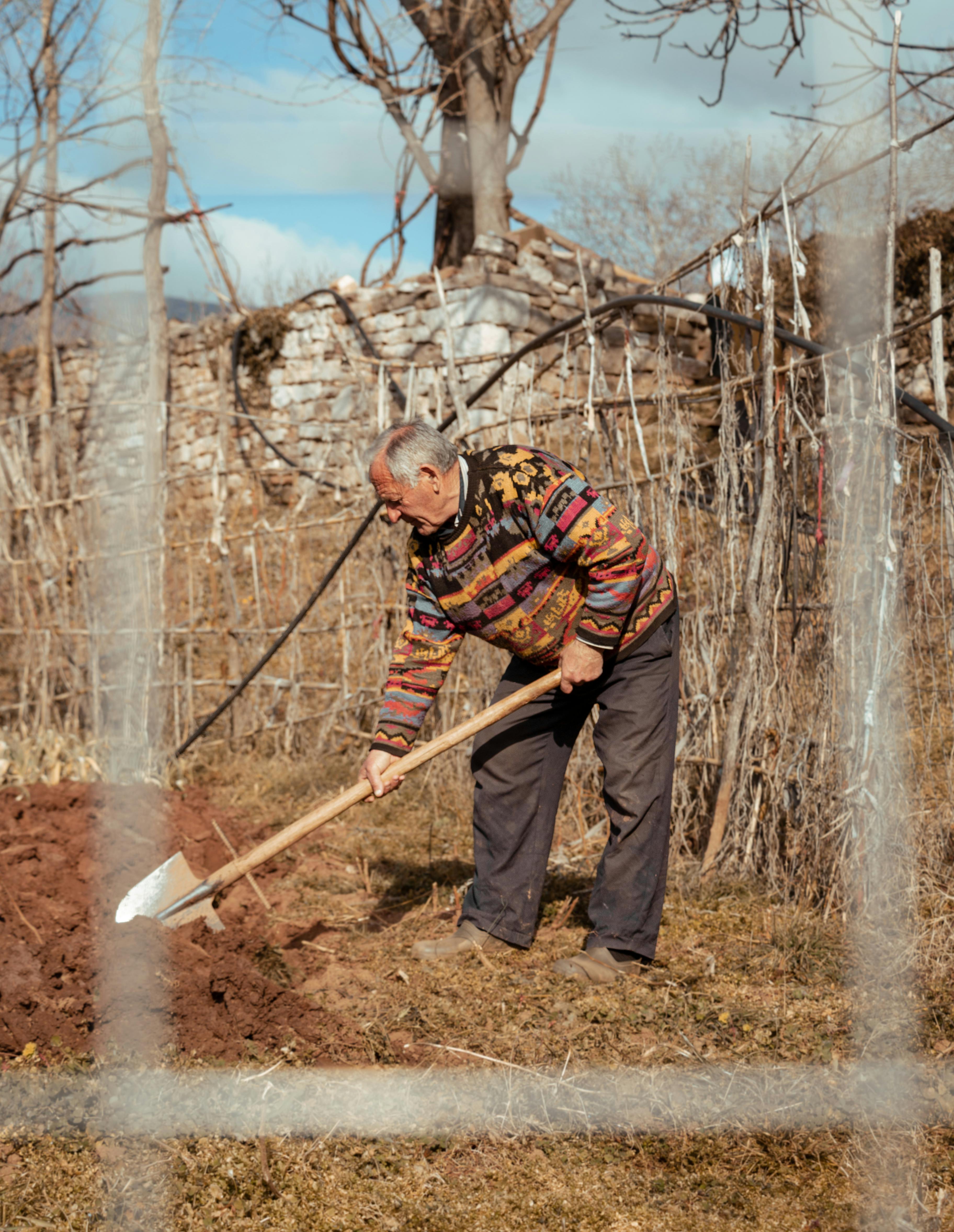 Person Digging Soil · Free Stock Photo