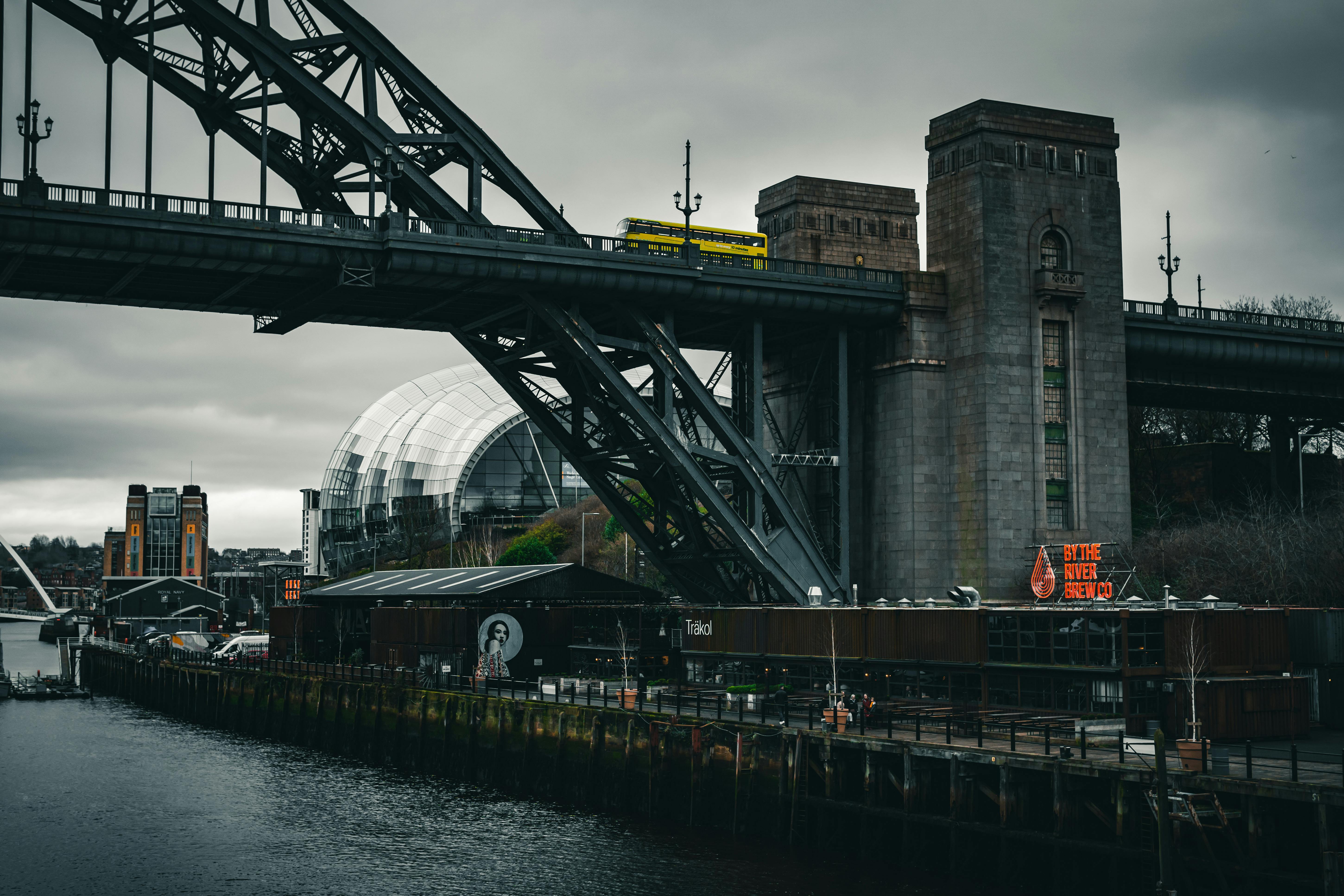 River and Bridge on an Overcast Day · Free Stock Photo