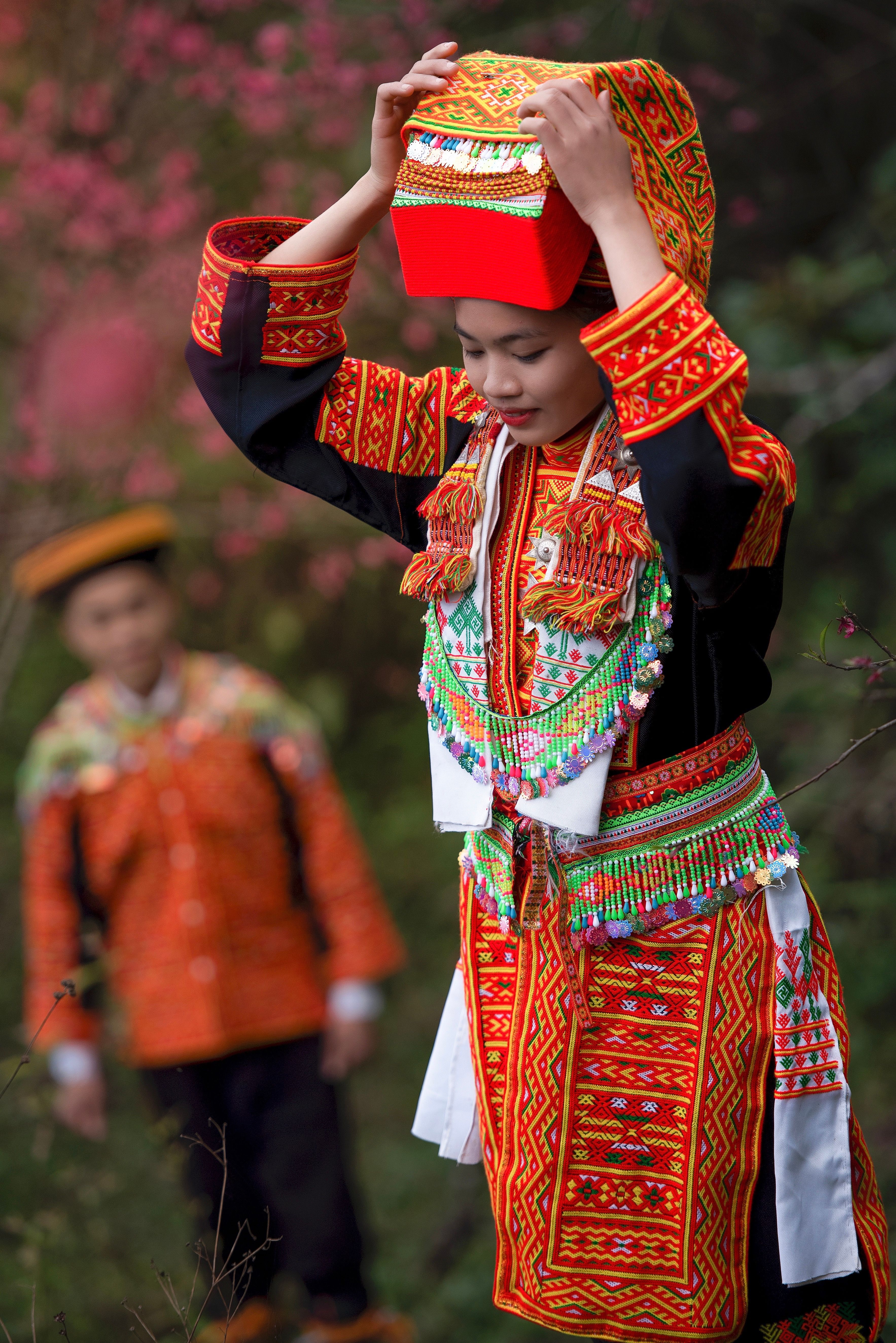 Woman and Man in Traditional Colorful Clothing · Free Stock Photo