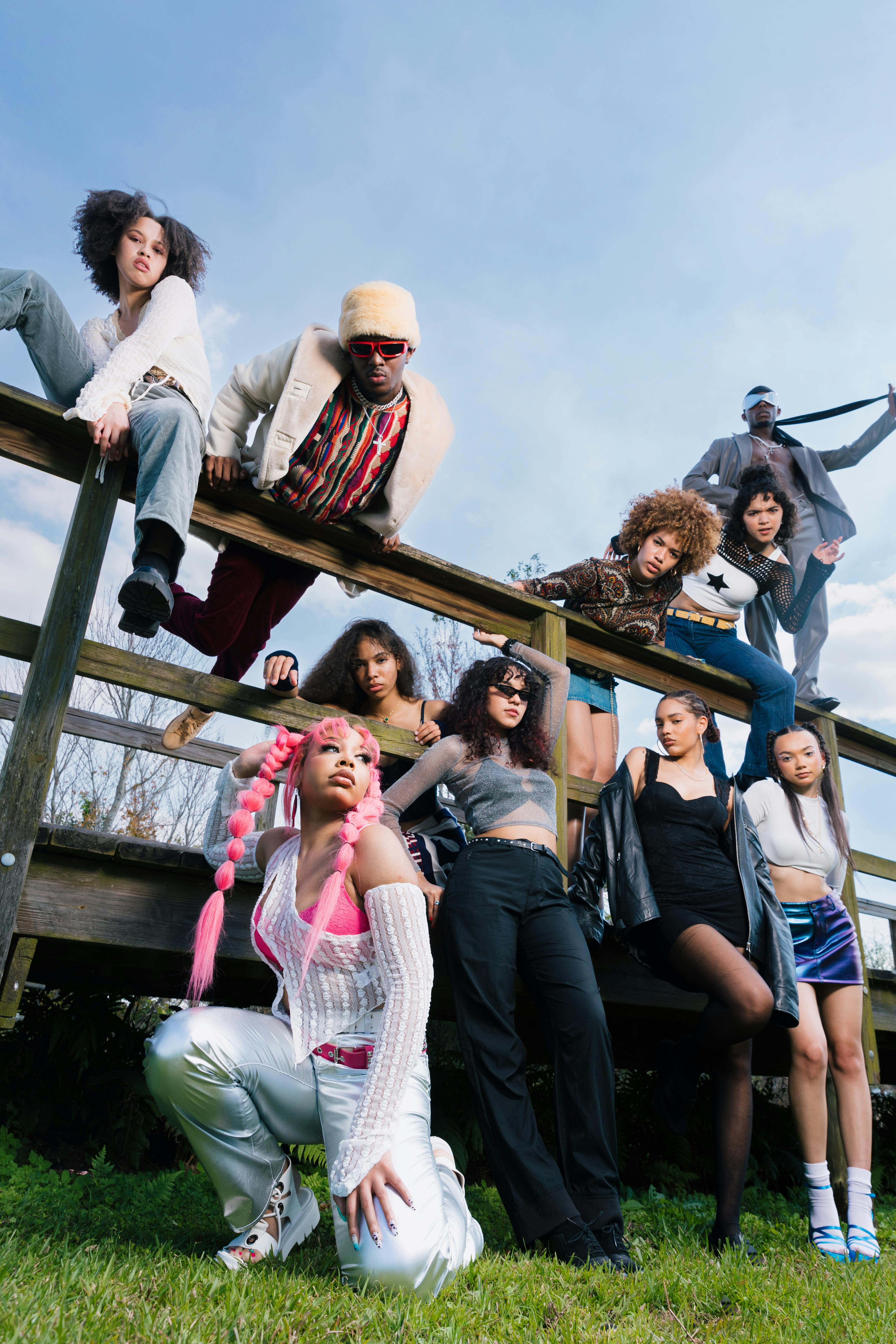 Low Angle Shot of a Group of Young, Fashionable People Posing Outside ...