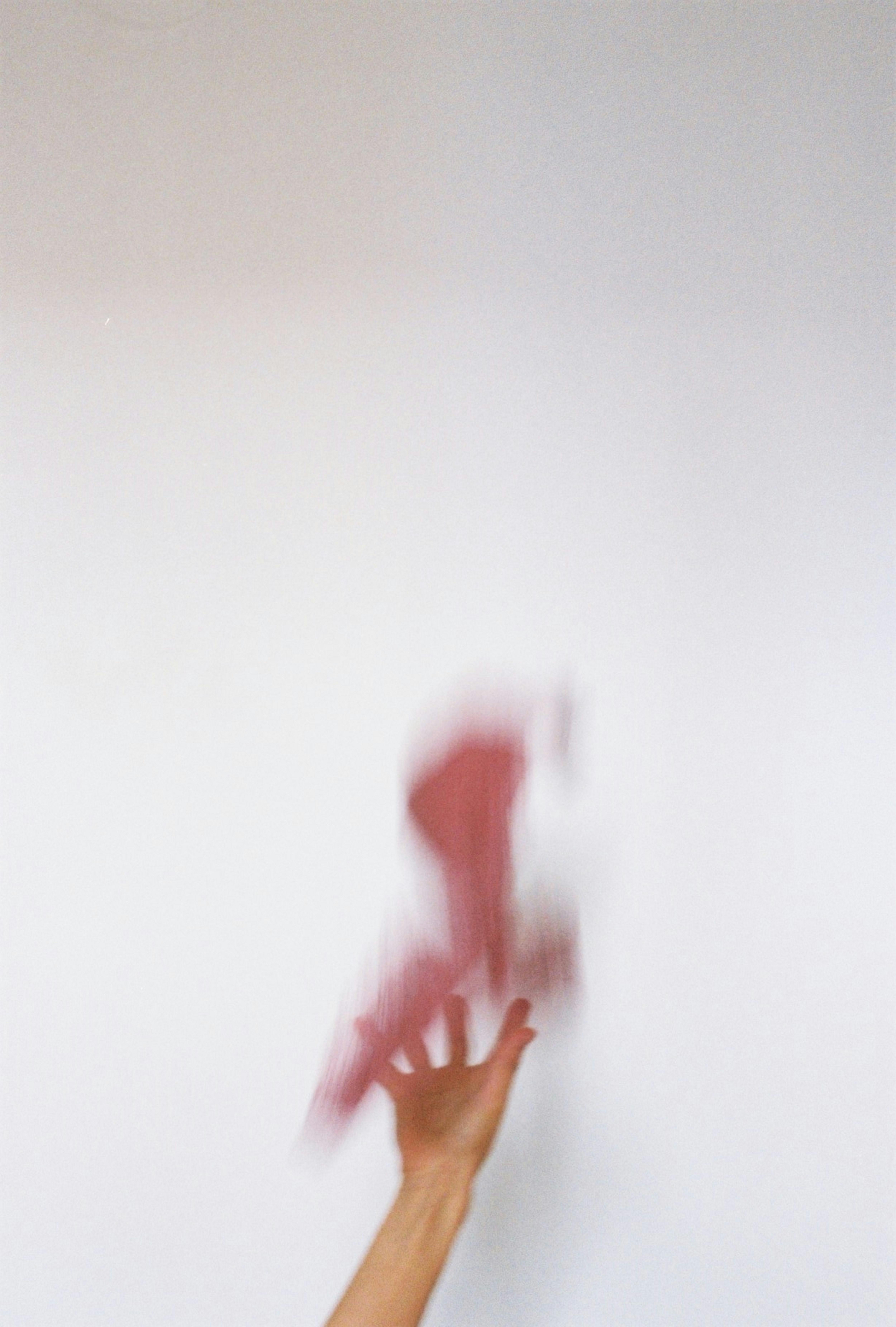 Hand Throwing Something · Free Stock Photo