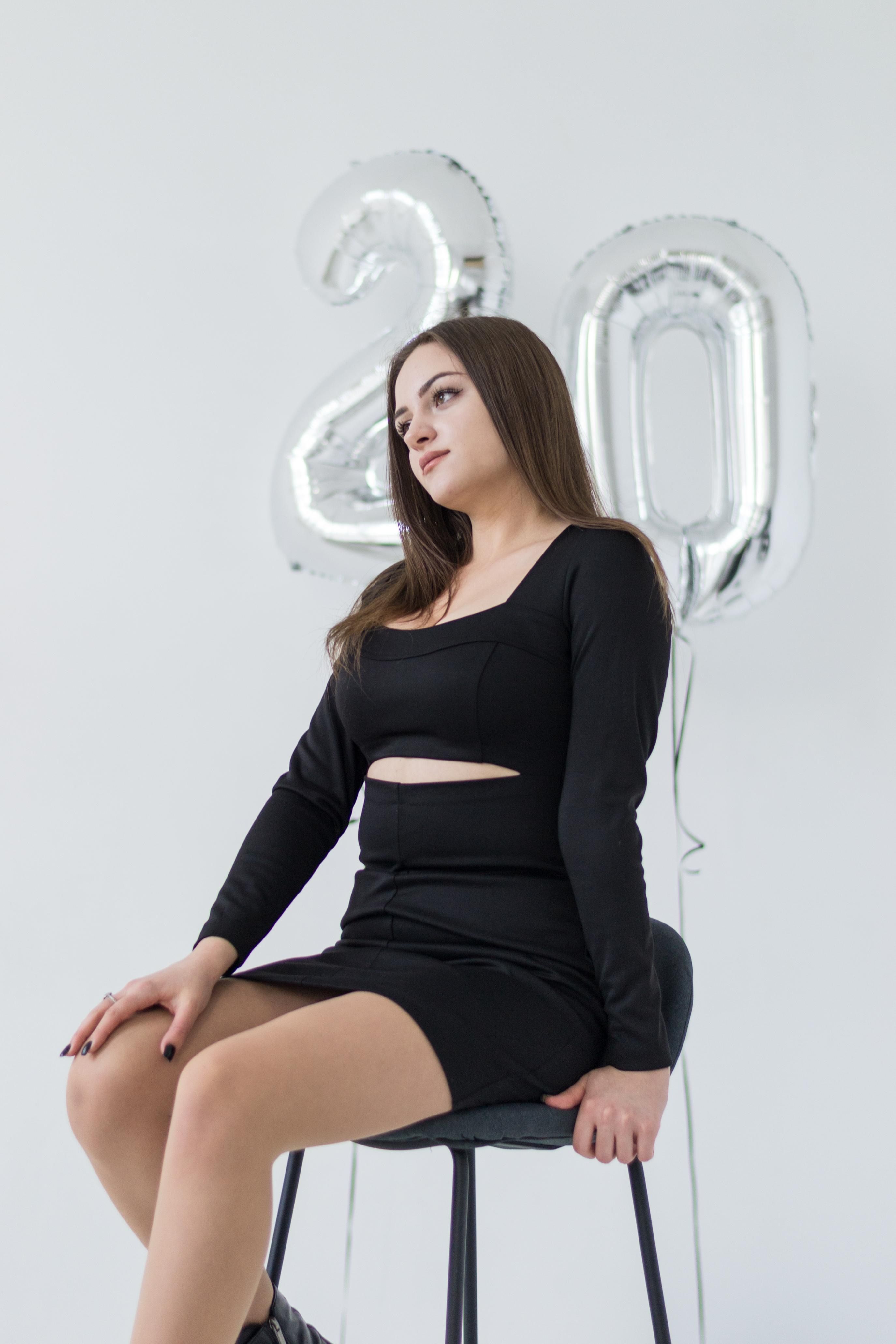 Woman Sitting and Posing with High Heel · Free Stock Photo