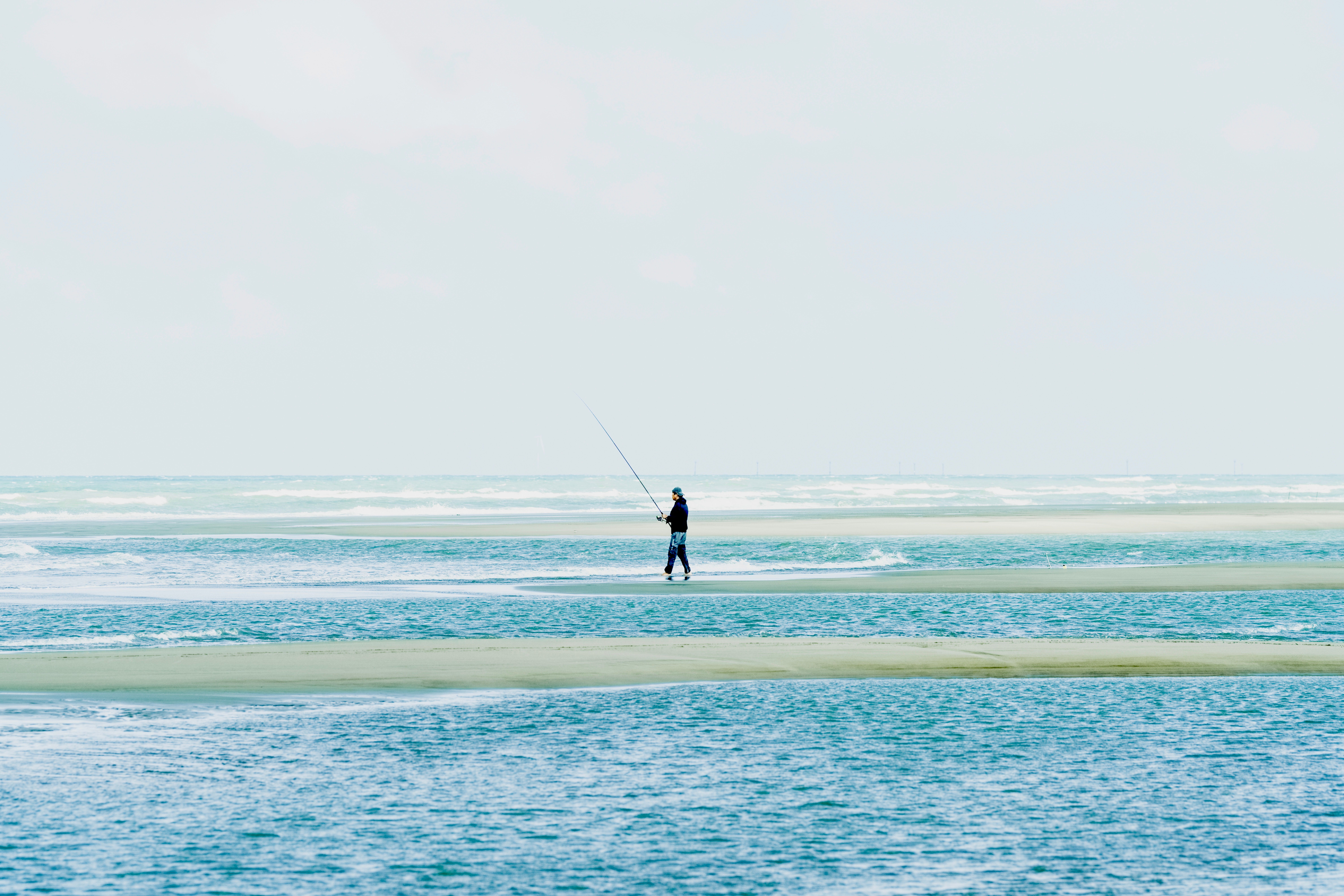 Man Fishing on Sea Shore · Free Stock Photo