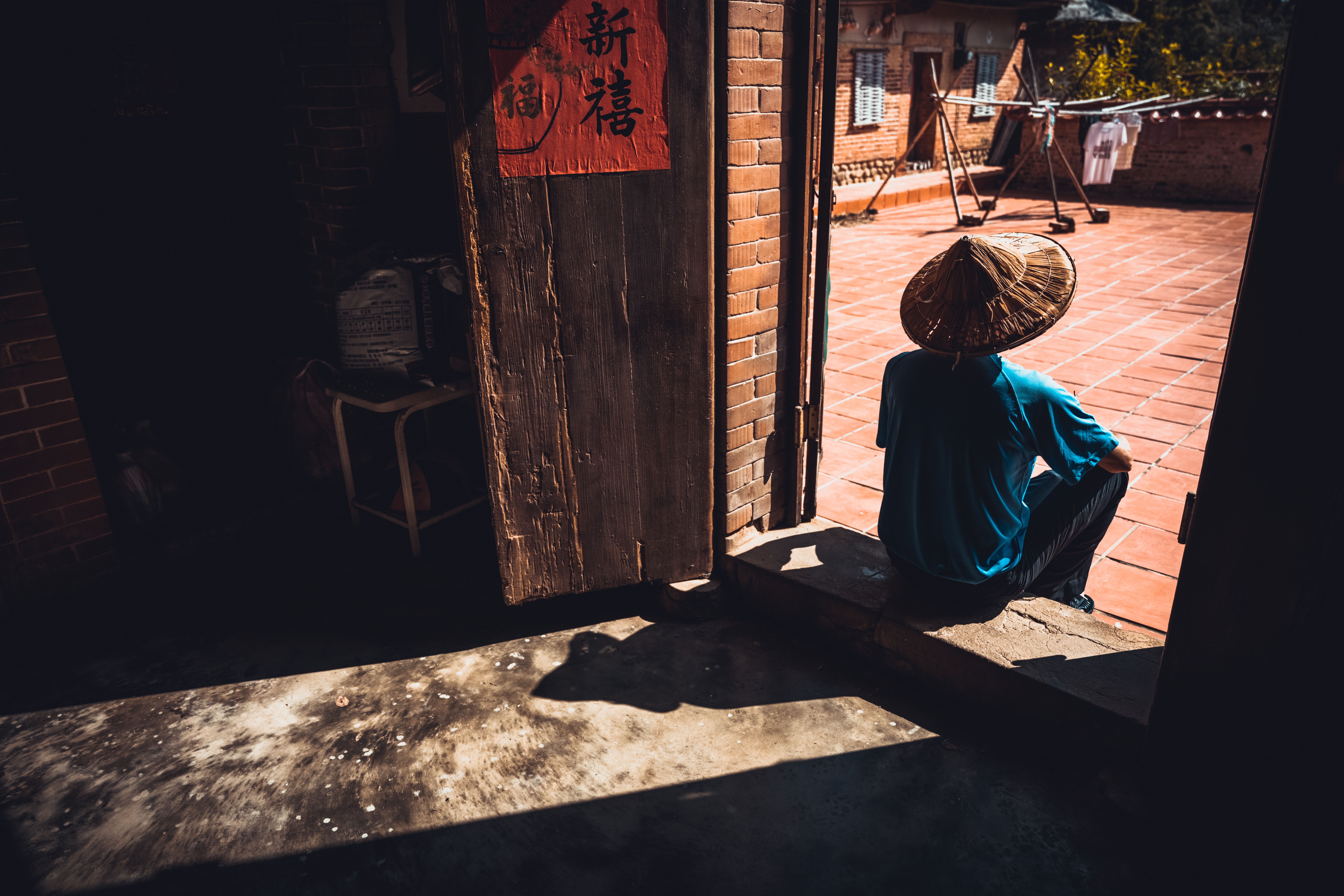 Man Sitting on Doorstep · Free Stock Photo