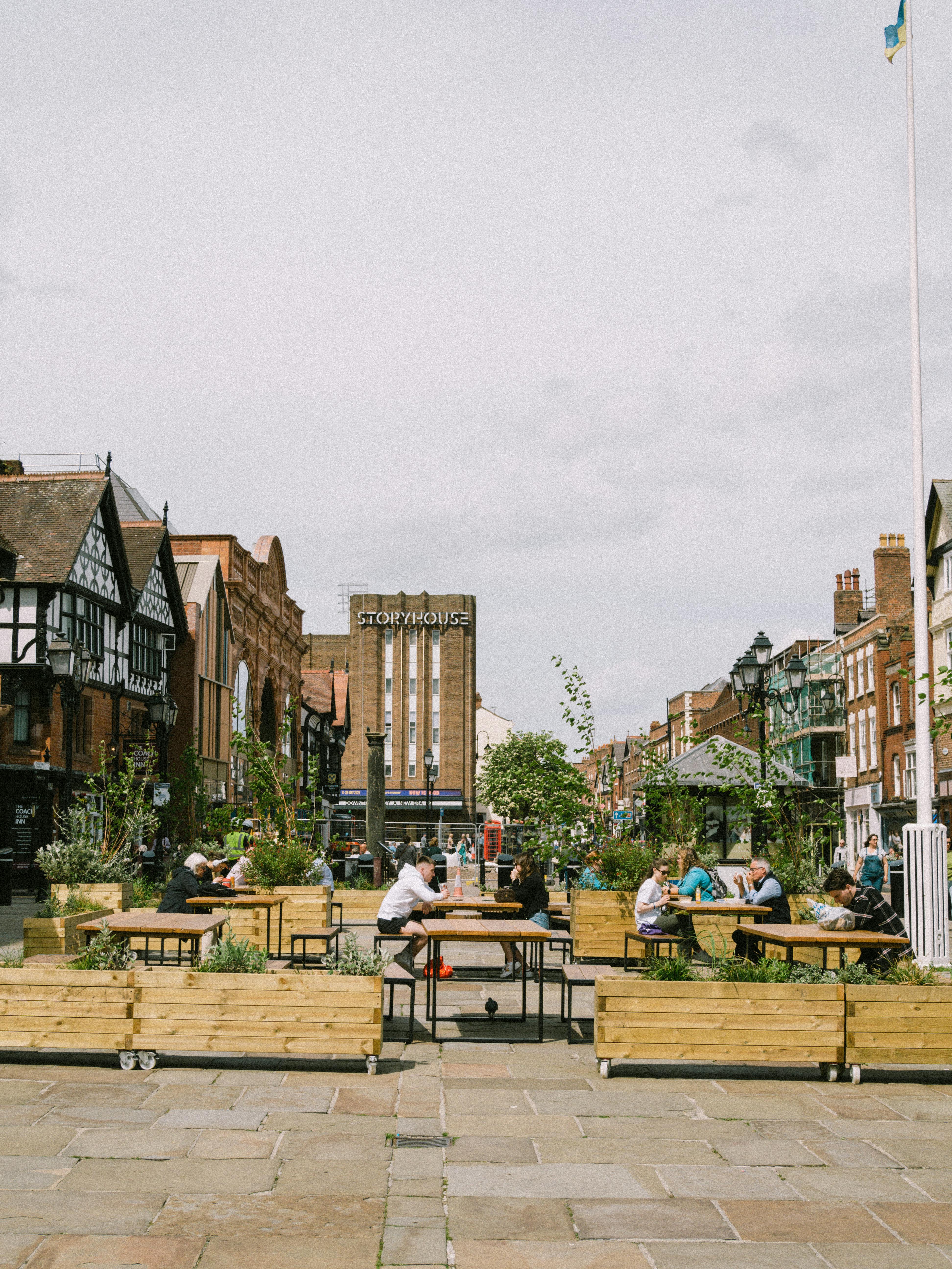 People Sitting on Square in Town · Free Stock Photo