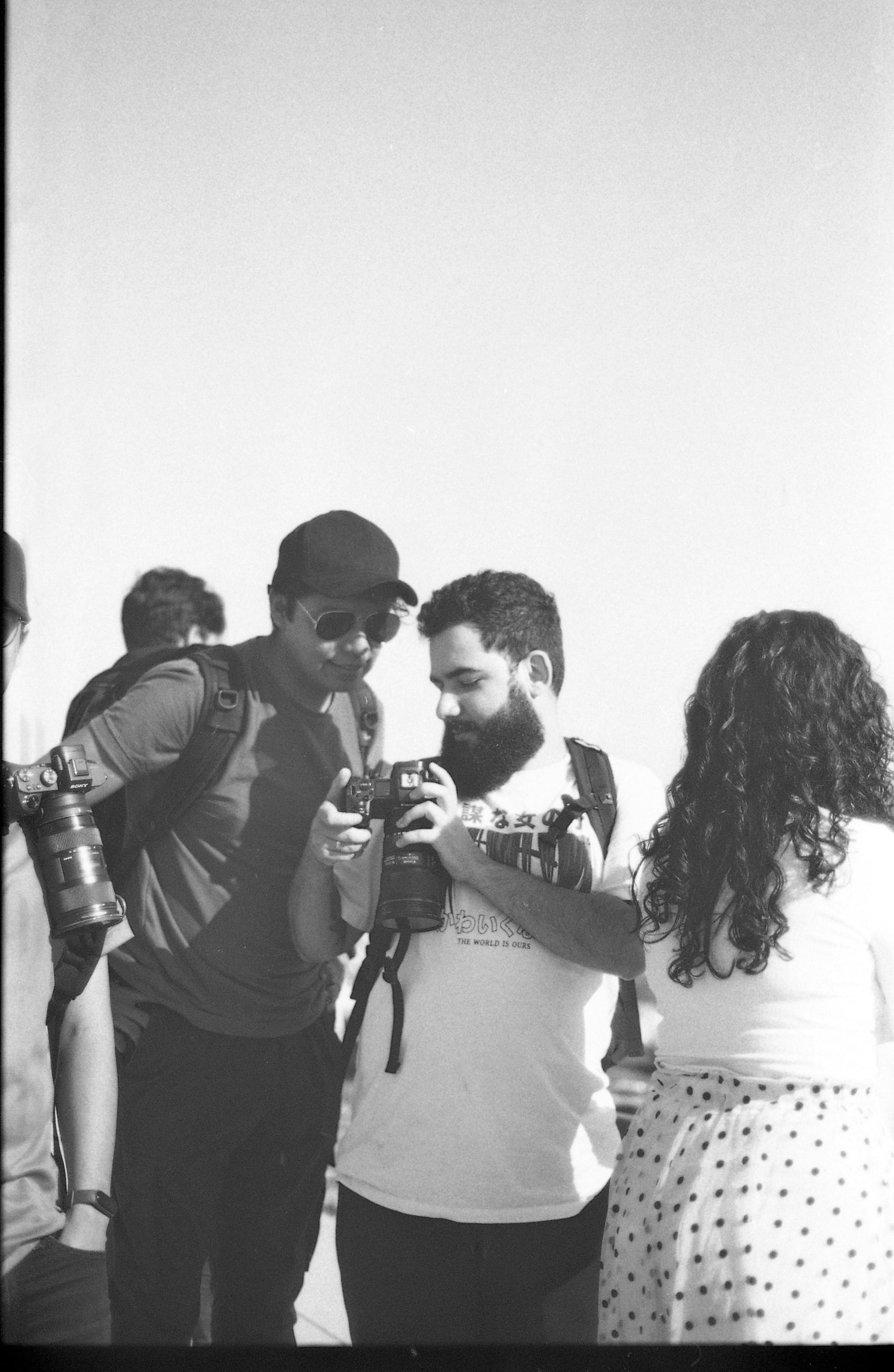 Man Showing Camera Screen · Free Stock Photo