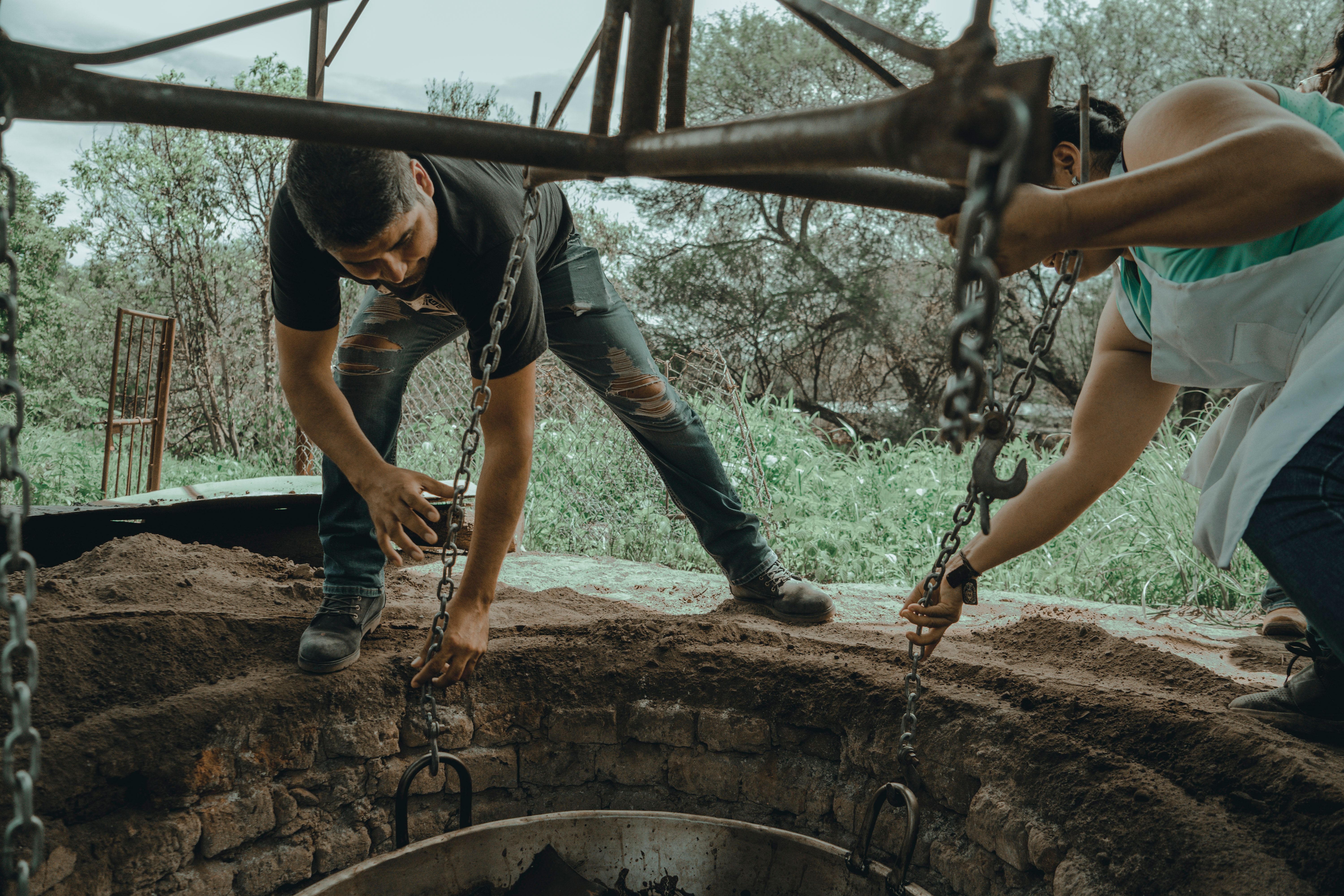 Man and Woman Working with Well · Free Stock Photo
