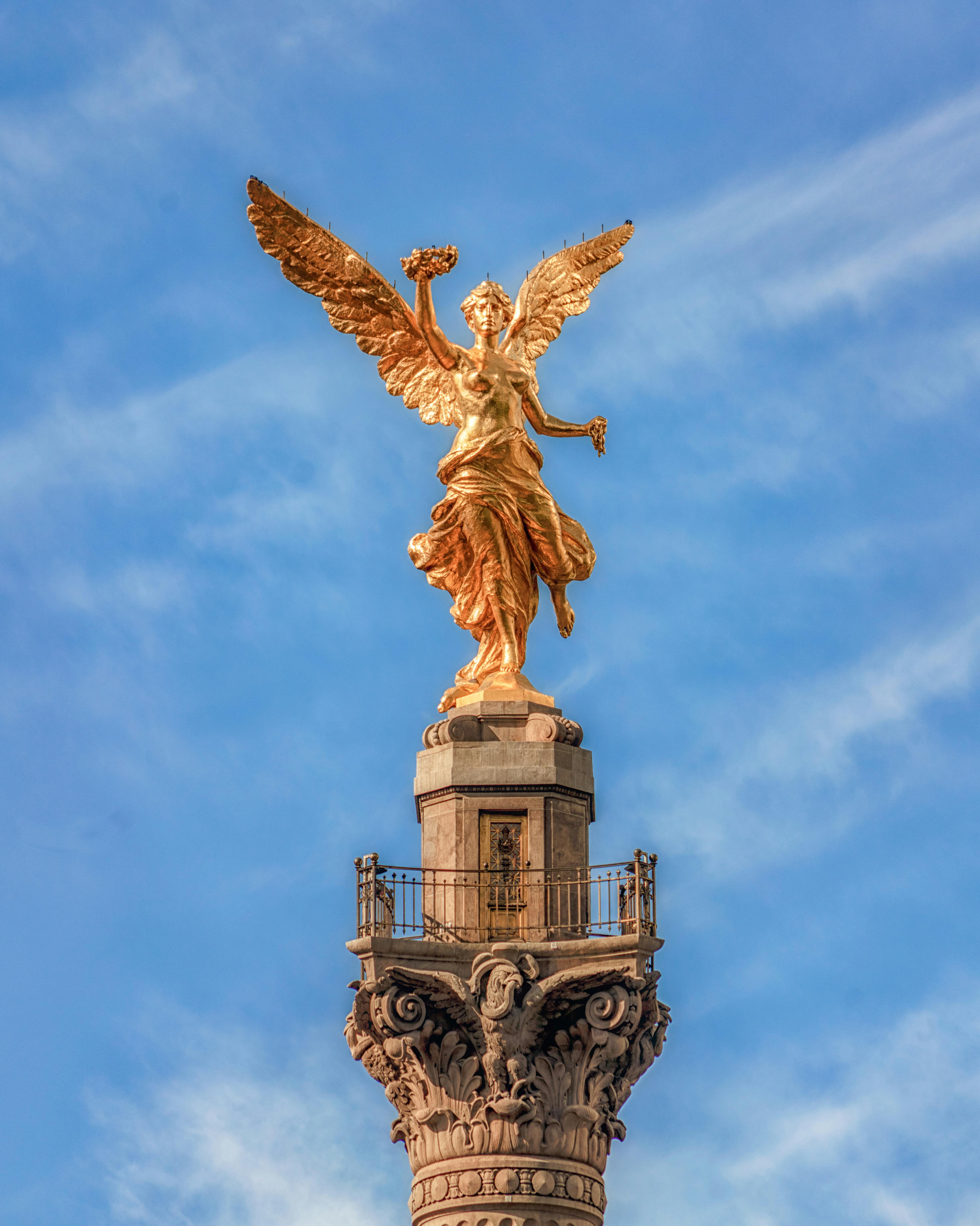Gold Plated Angel of Independence Statue in Mexico City Against a Blue ...