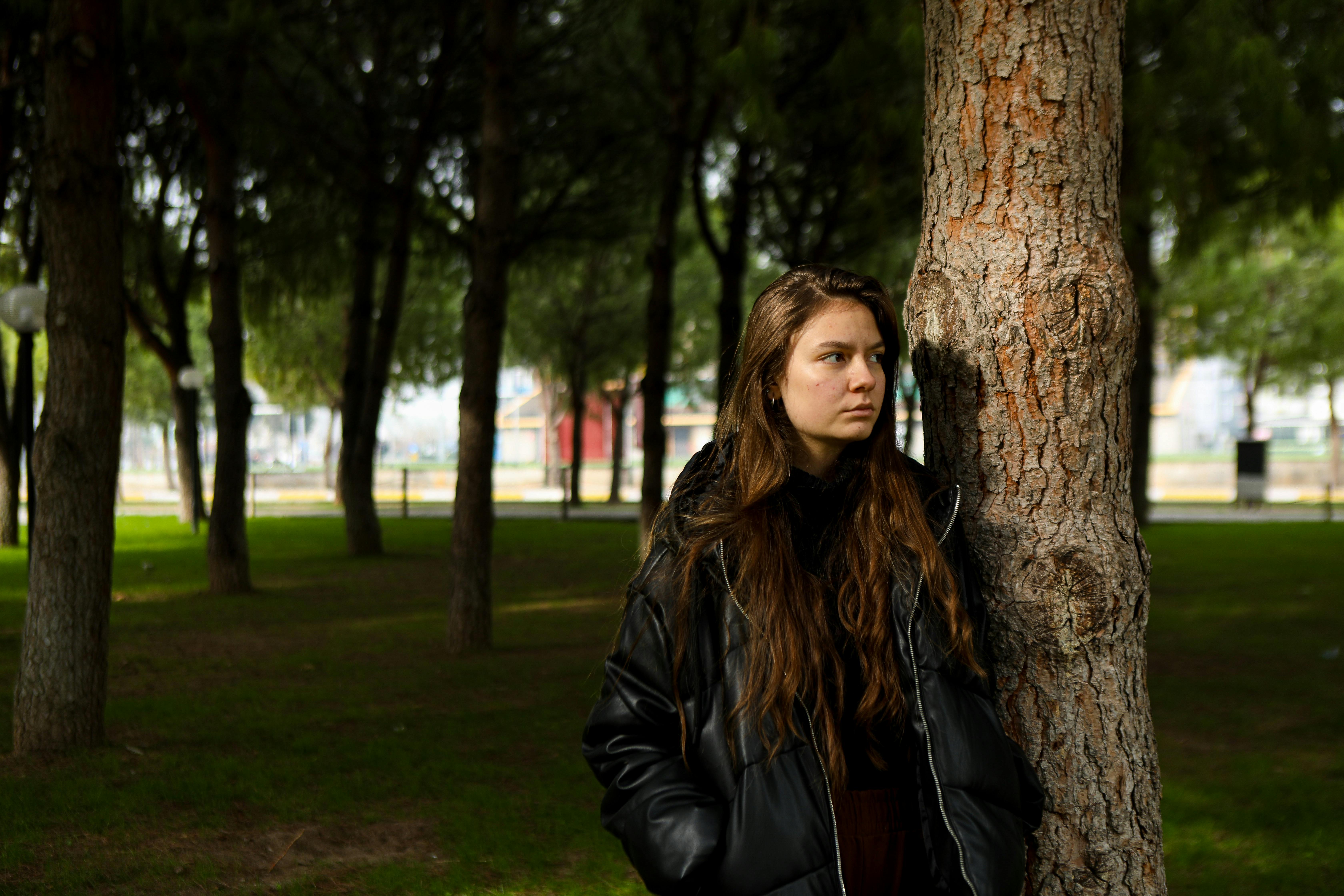 Girl Standing near Tree in Park · Free Stock Photo