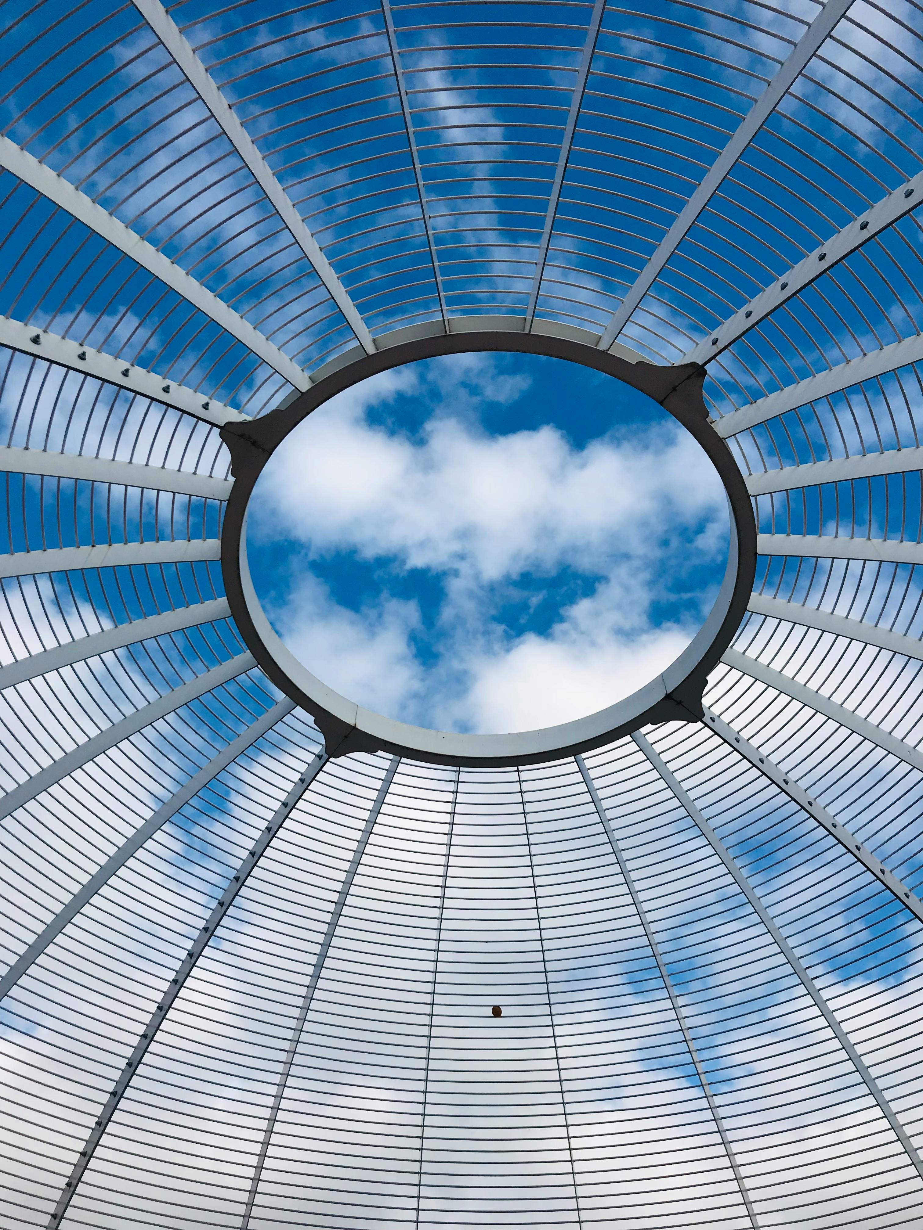 Clouds over Installation with Bars and Circle · Free Stock Photo