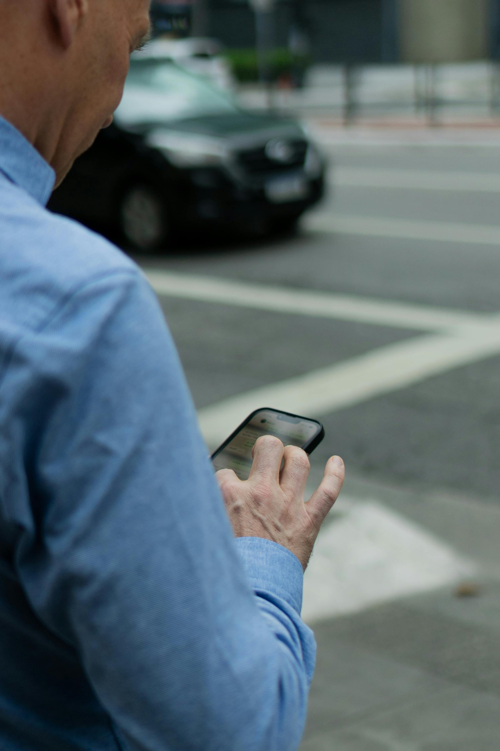 Man Looking at Cellphone · Free Stock Photo