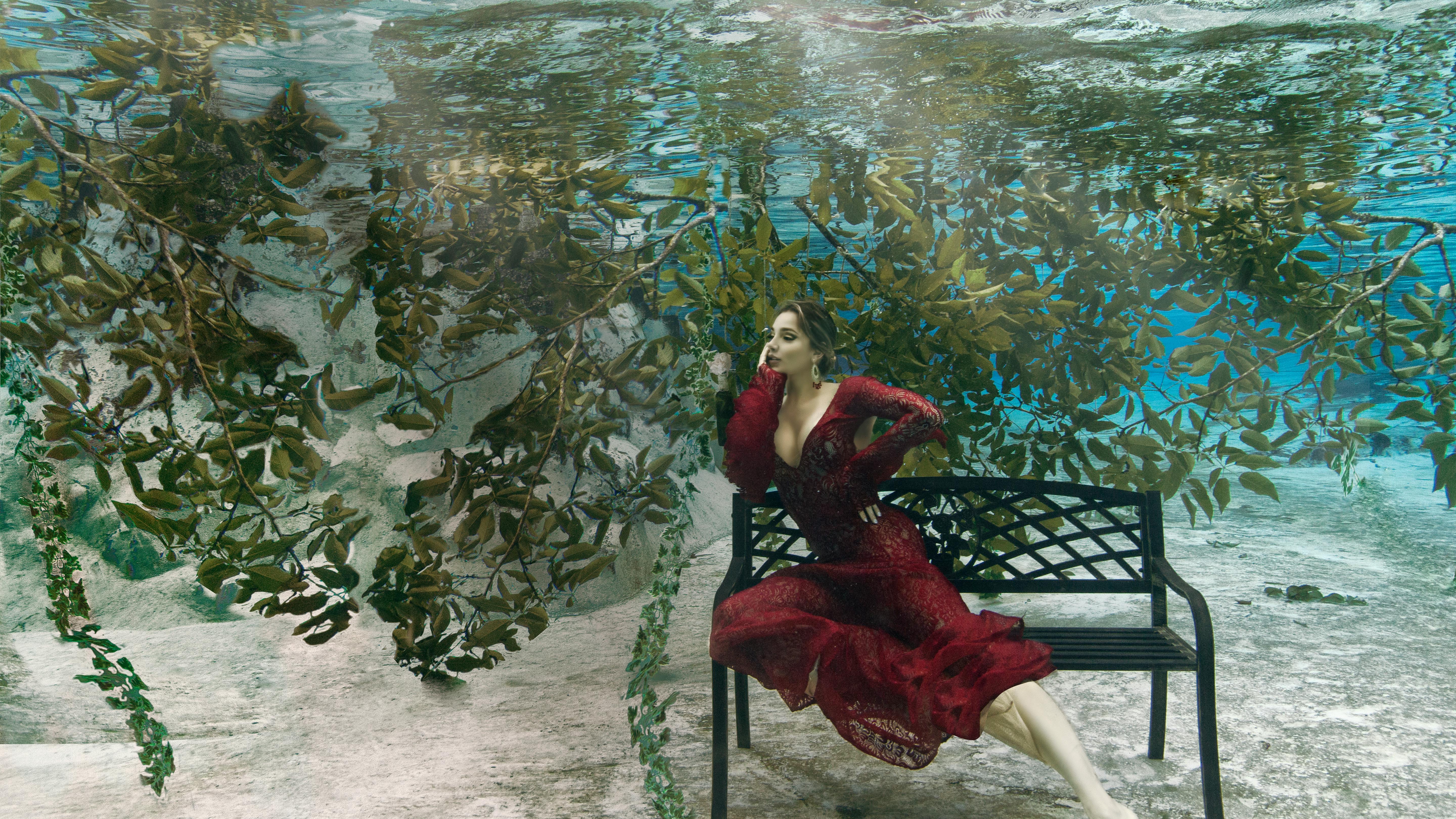 Female Model Posing on an Underwater Bench · Free Stock Photo