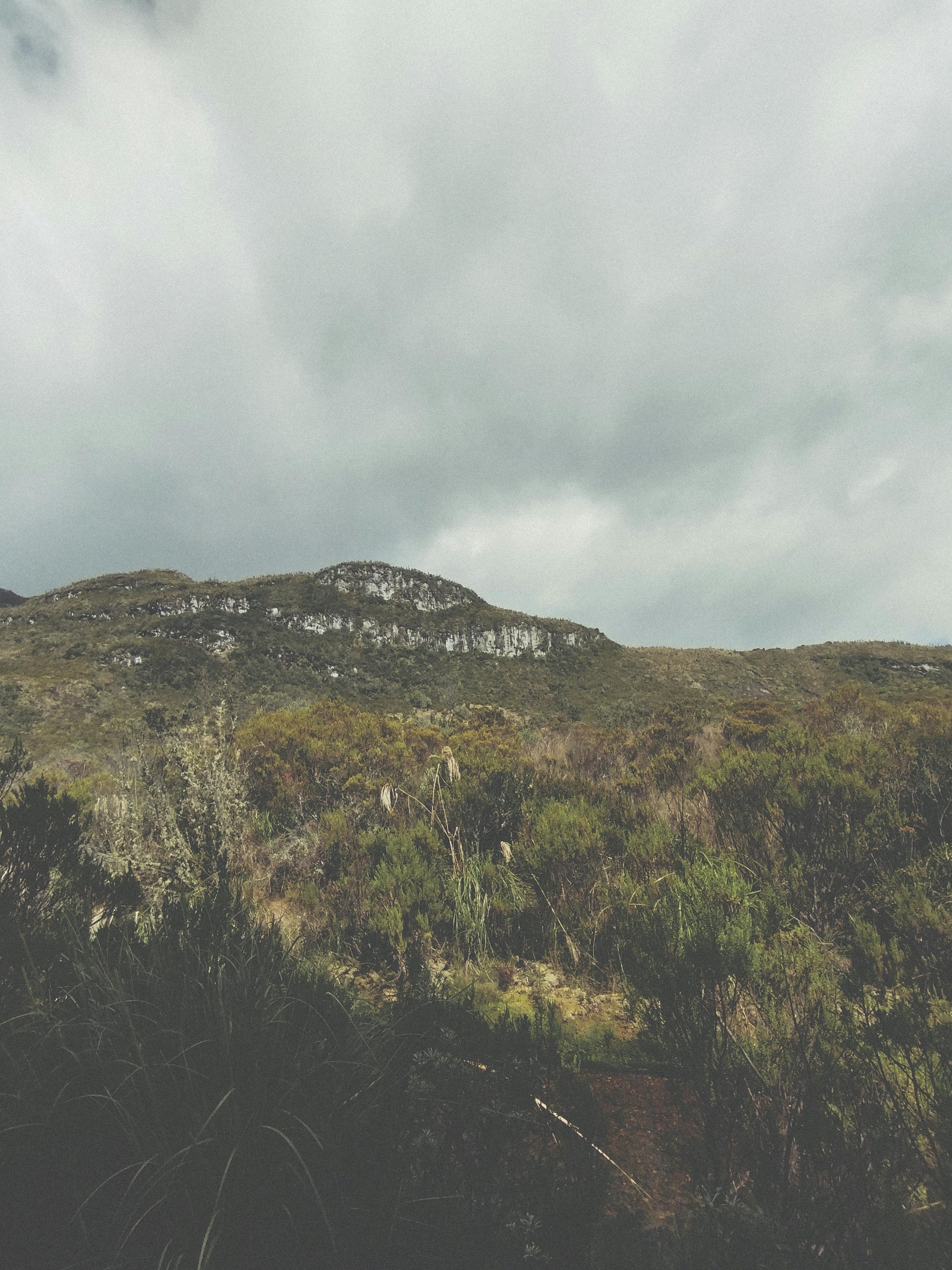 Clouds Casting Shadow on Rolling Landscape · Free Stock Photo