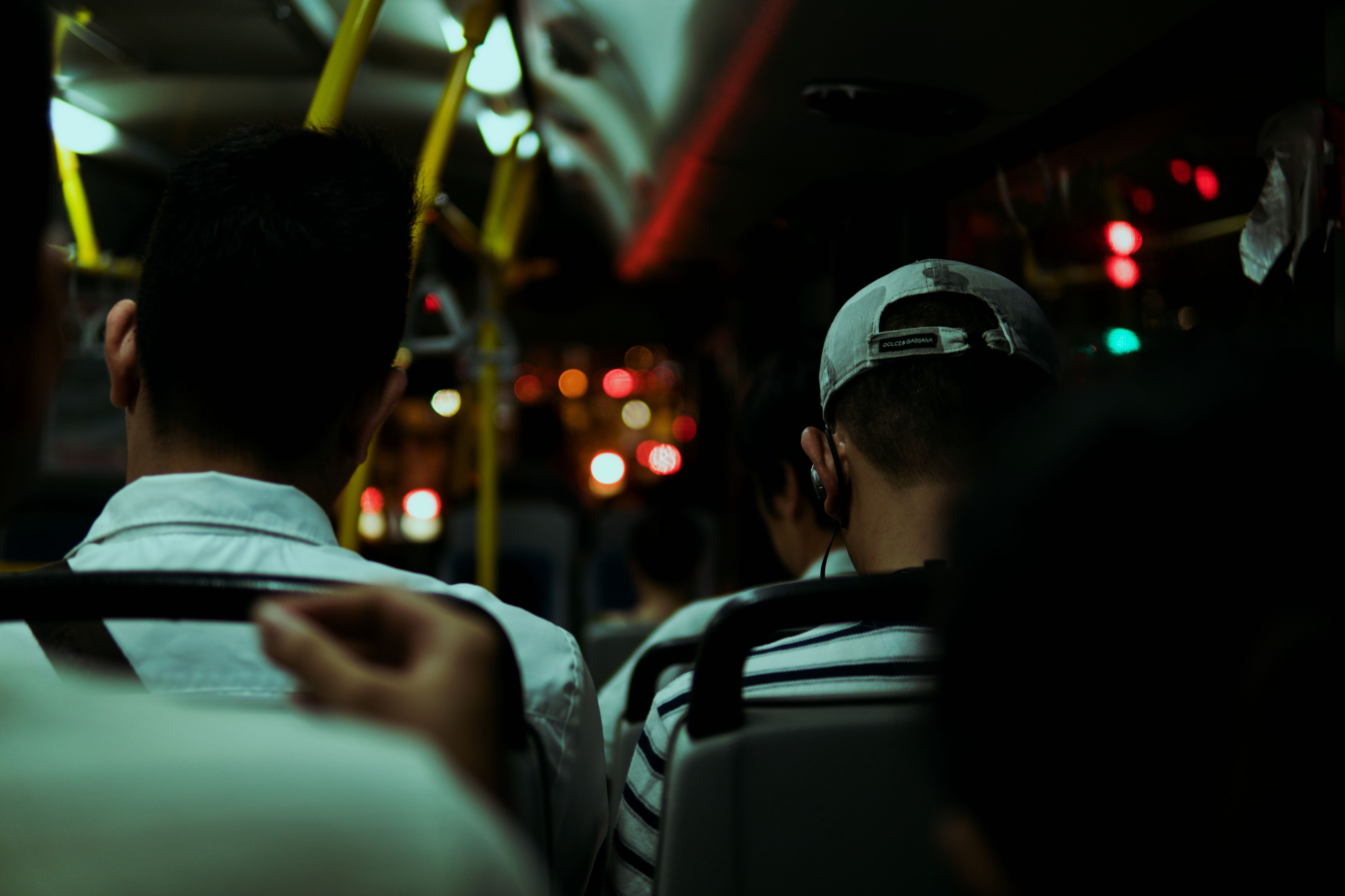 Two Men Sitting Inside Bus during Night Time · Free Stock Photo