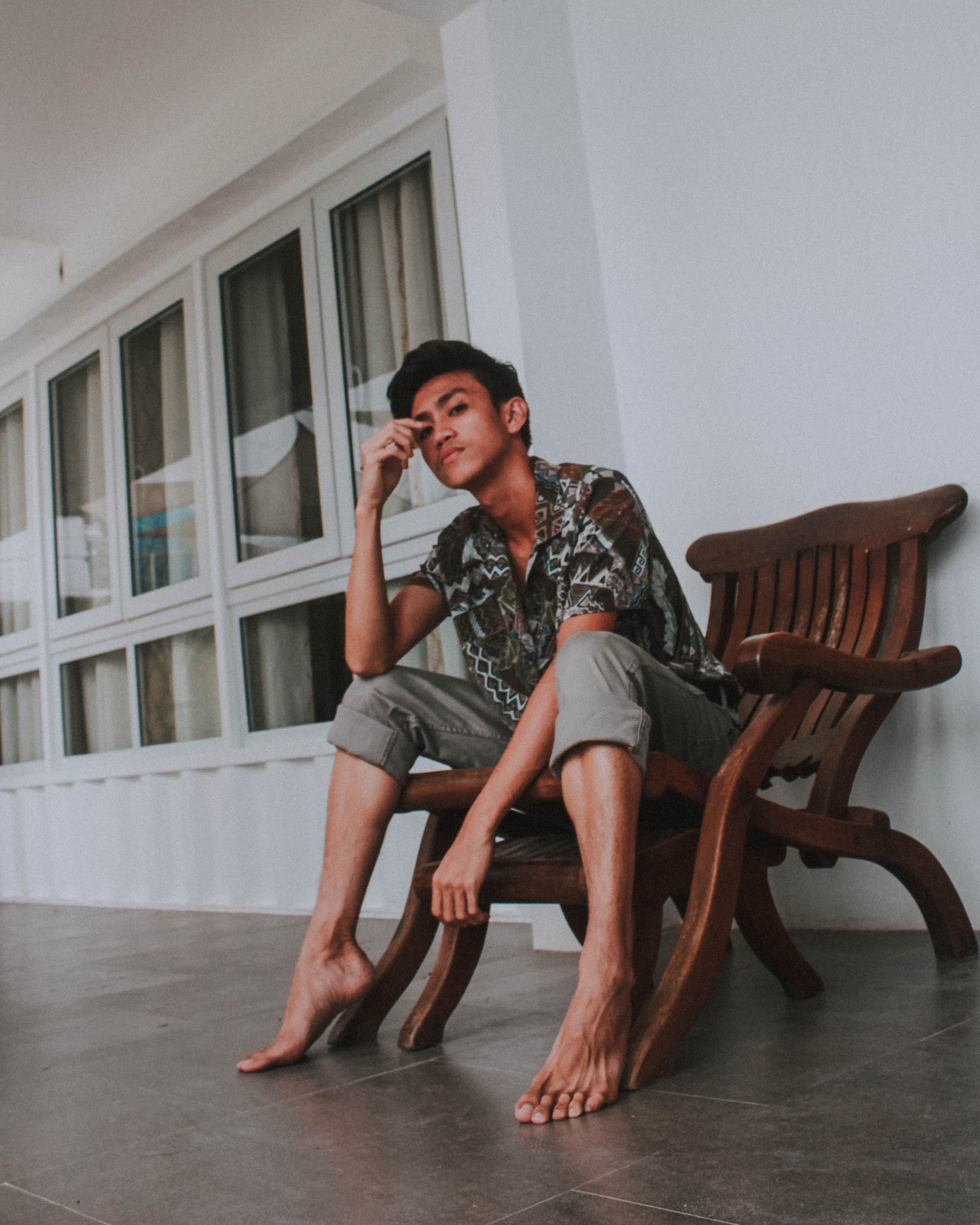 Man in Hat Sitting on Chair · Free Stock Photo
