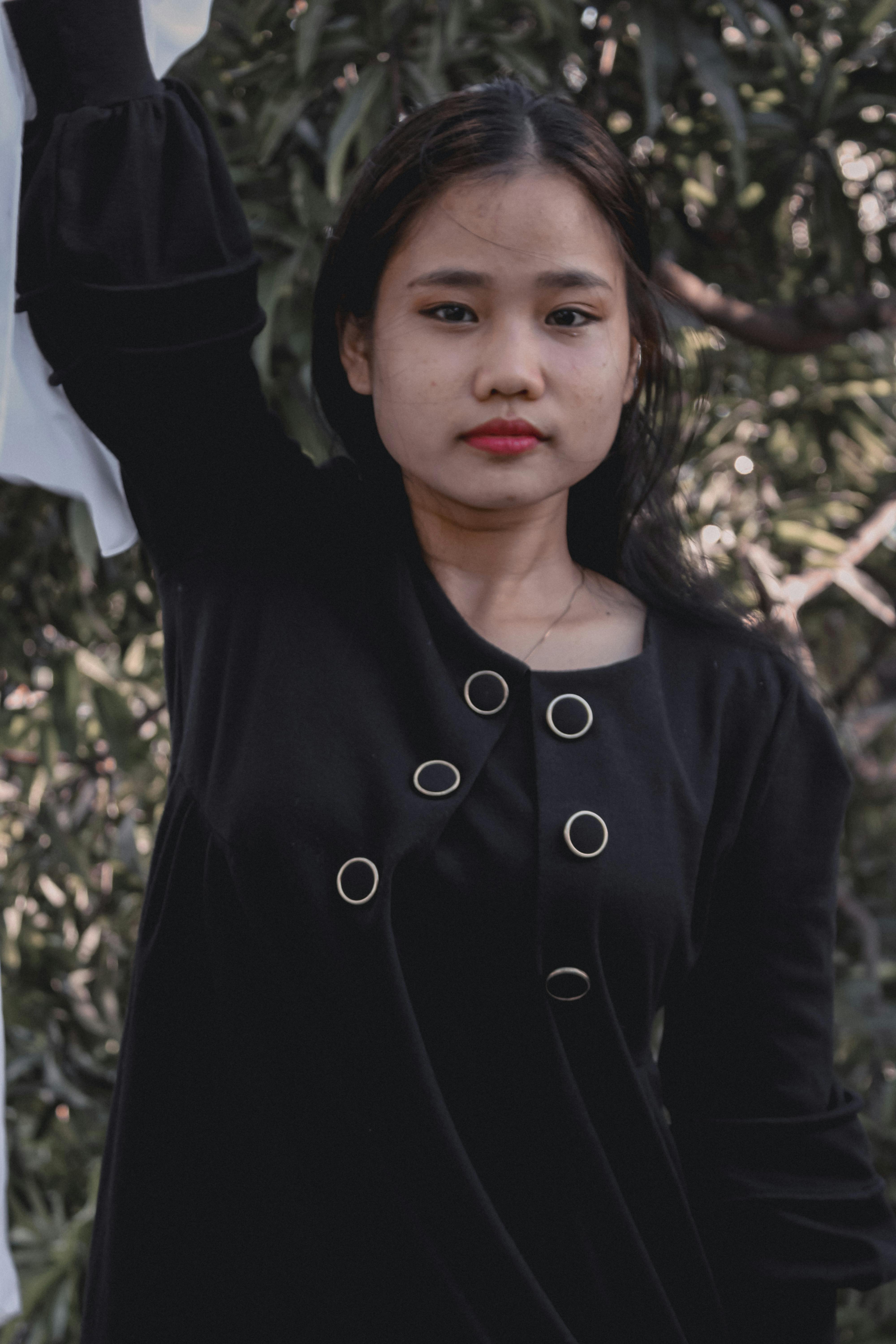 Woman with Raised Hand · Free Stock Photo