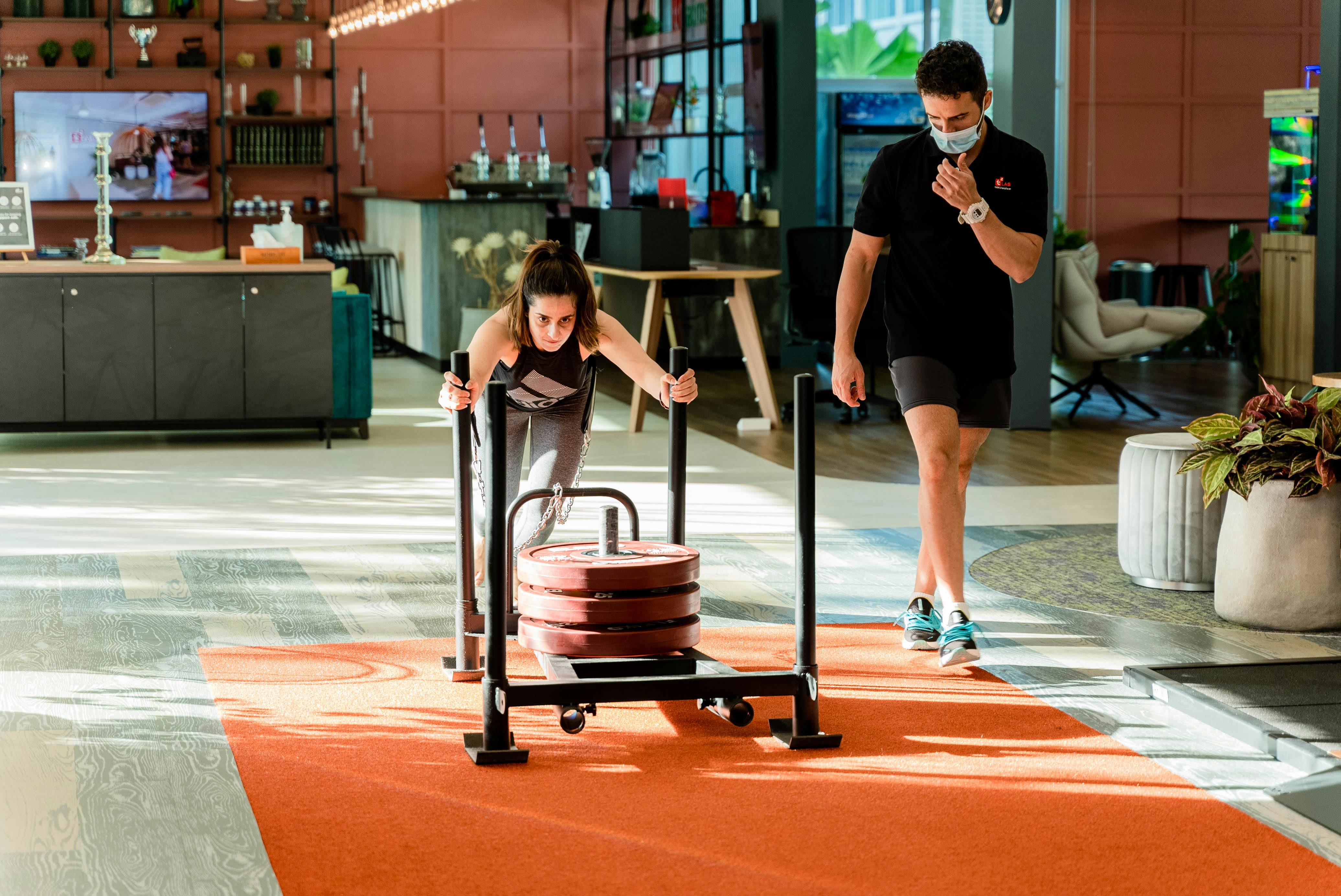 Woman using Prowler Sled in her Training · Free Stock Photo