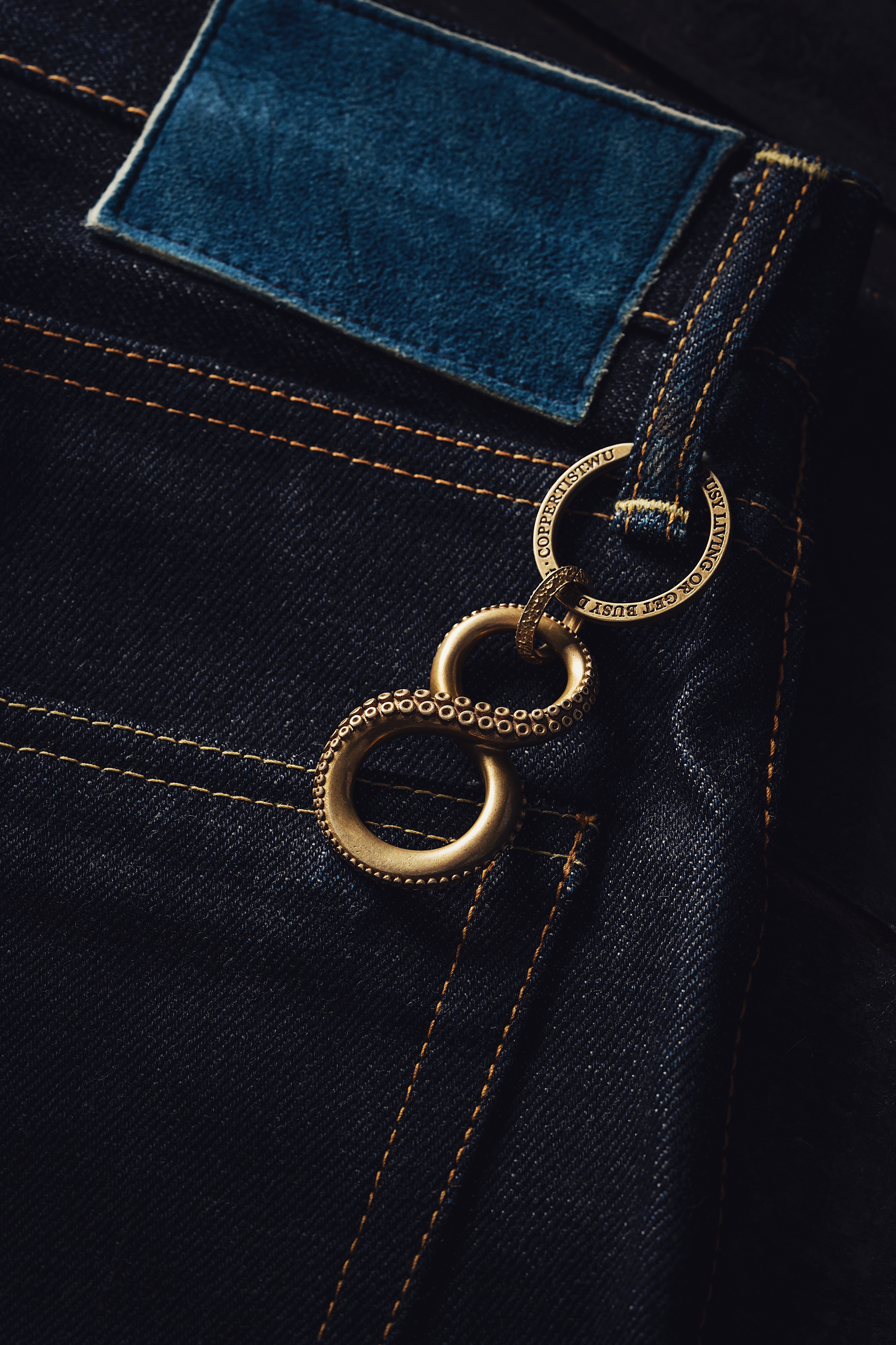 Octopus Infinity Symbol Keychain on Jeans Belt Loop · Free Stock Photo