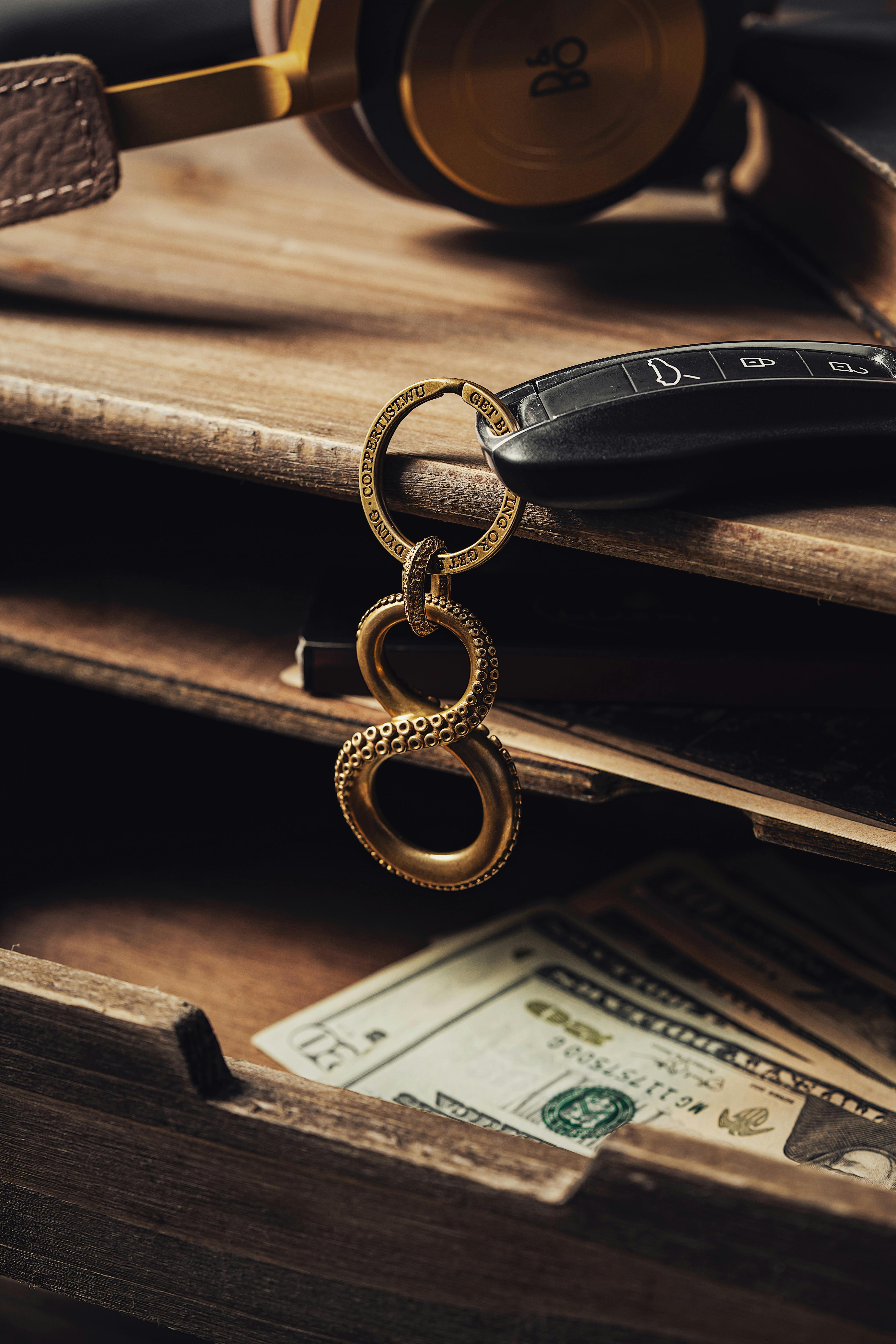 Key Ring with a Car Remote Control Lying on a Wooden Drawer · Free ...