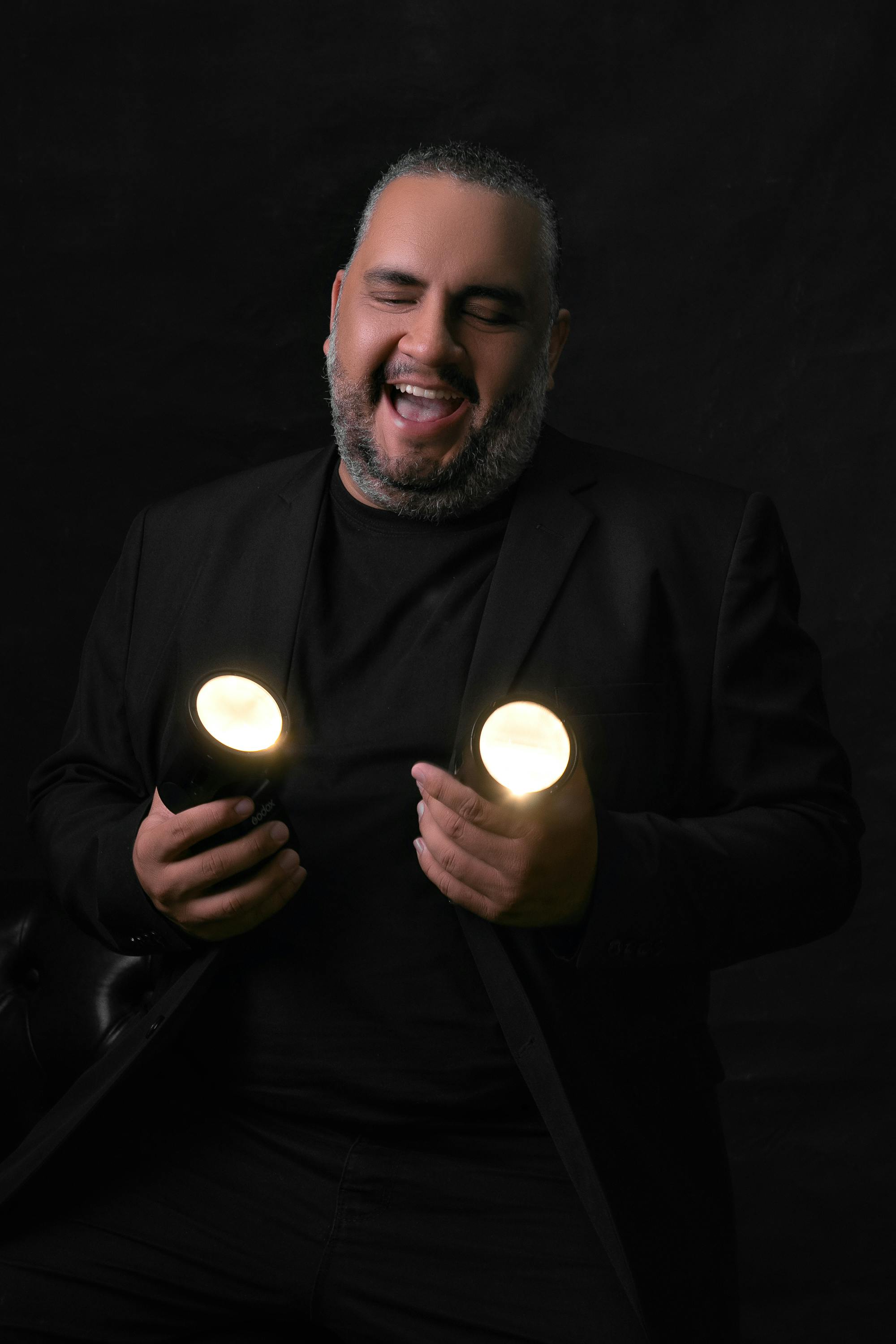 Man Holding Flashlight Torches and Laughing · Free Stock Photo