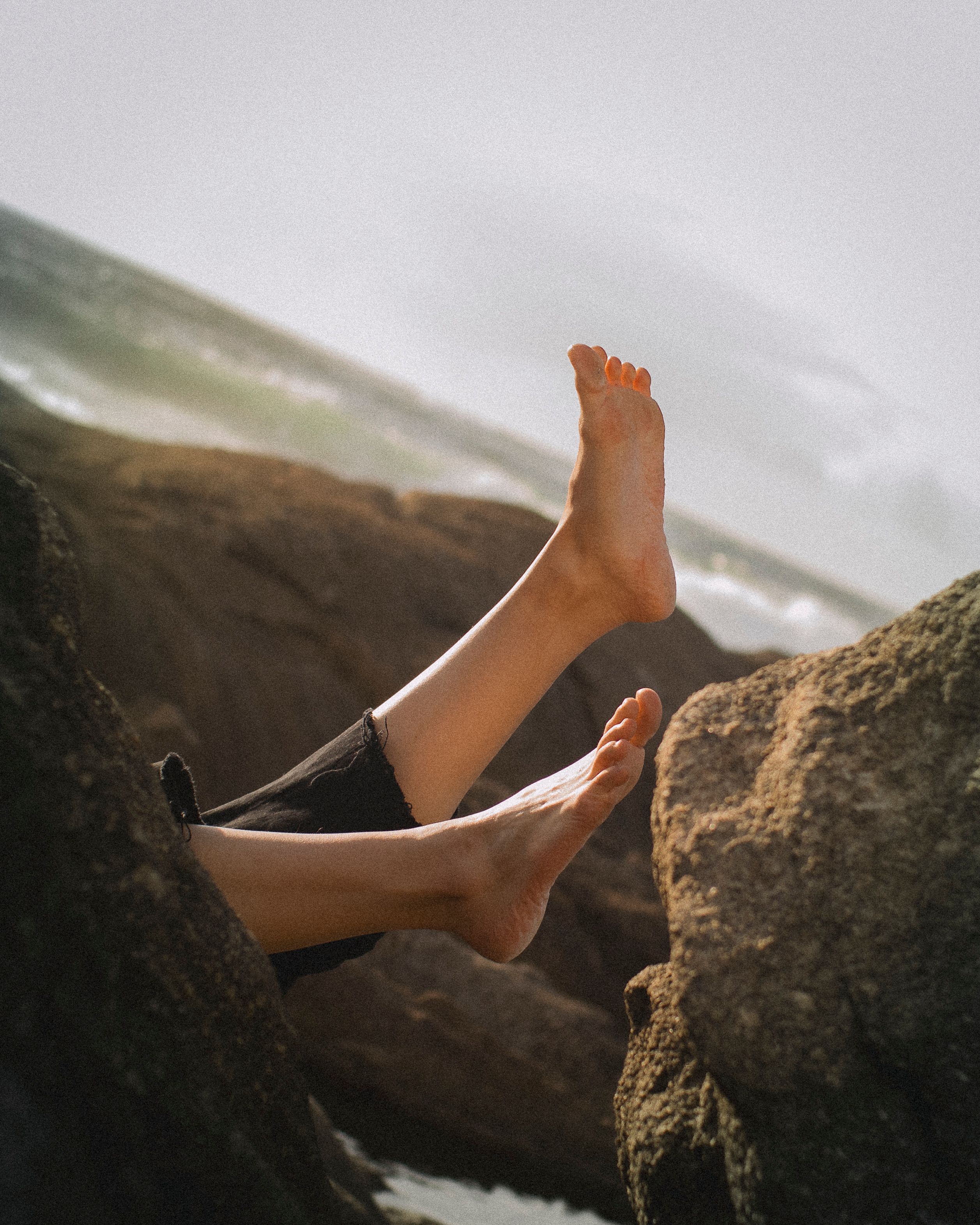 Bare Feet among Rocks on the Shore · Free Stock Photo