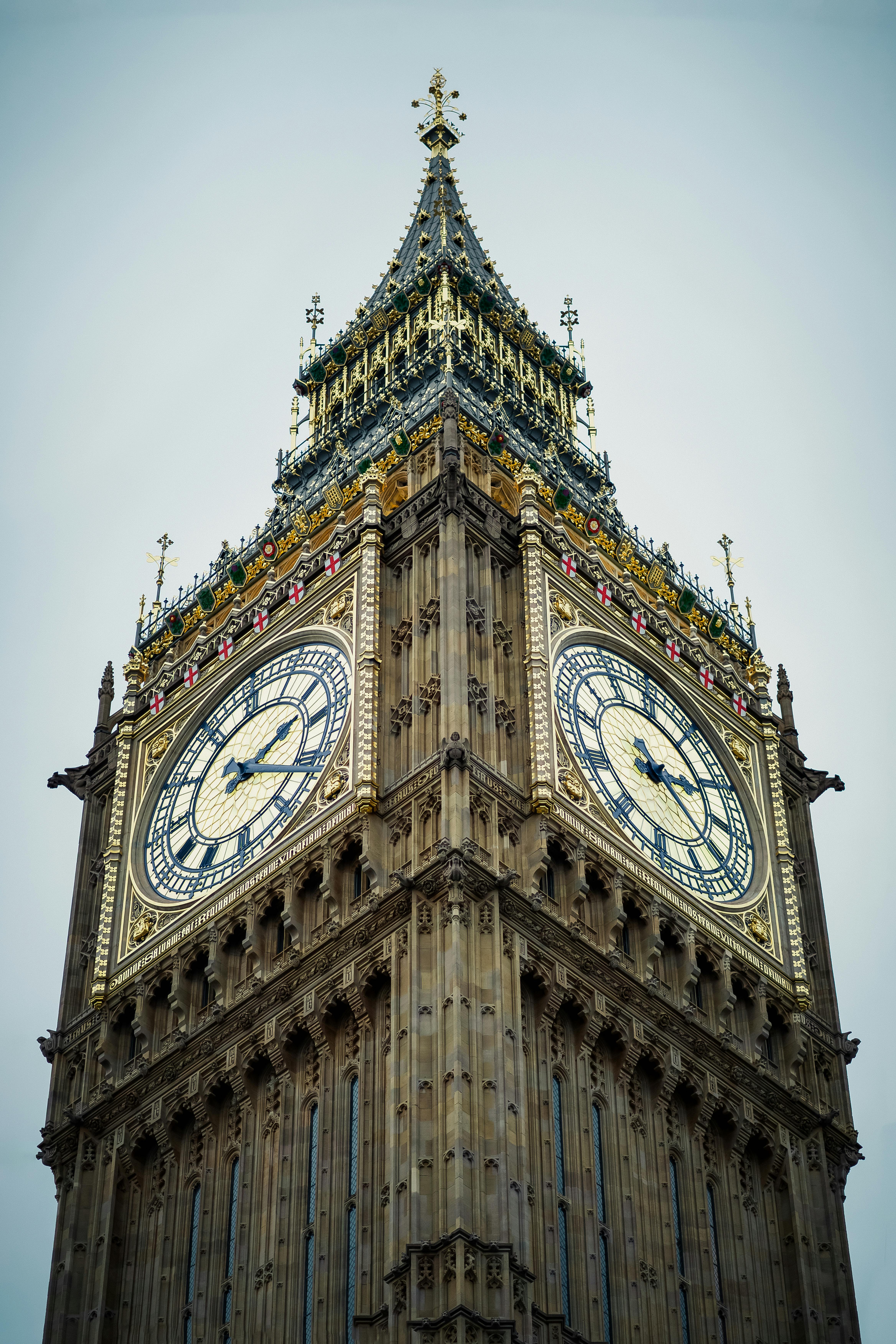 Low Angle View of Clock Tower Against Blue Sky · Free Stock Photo