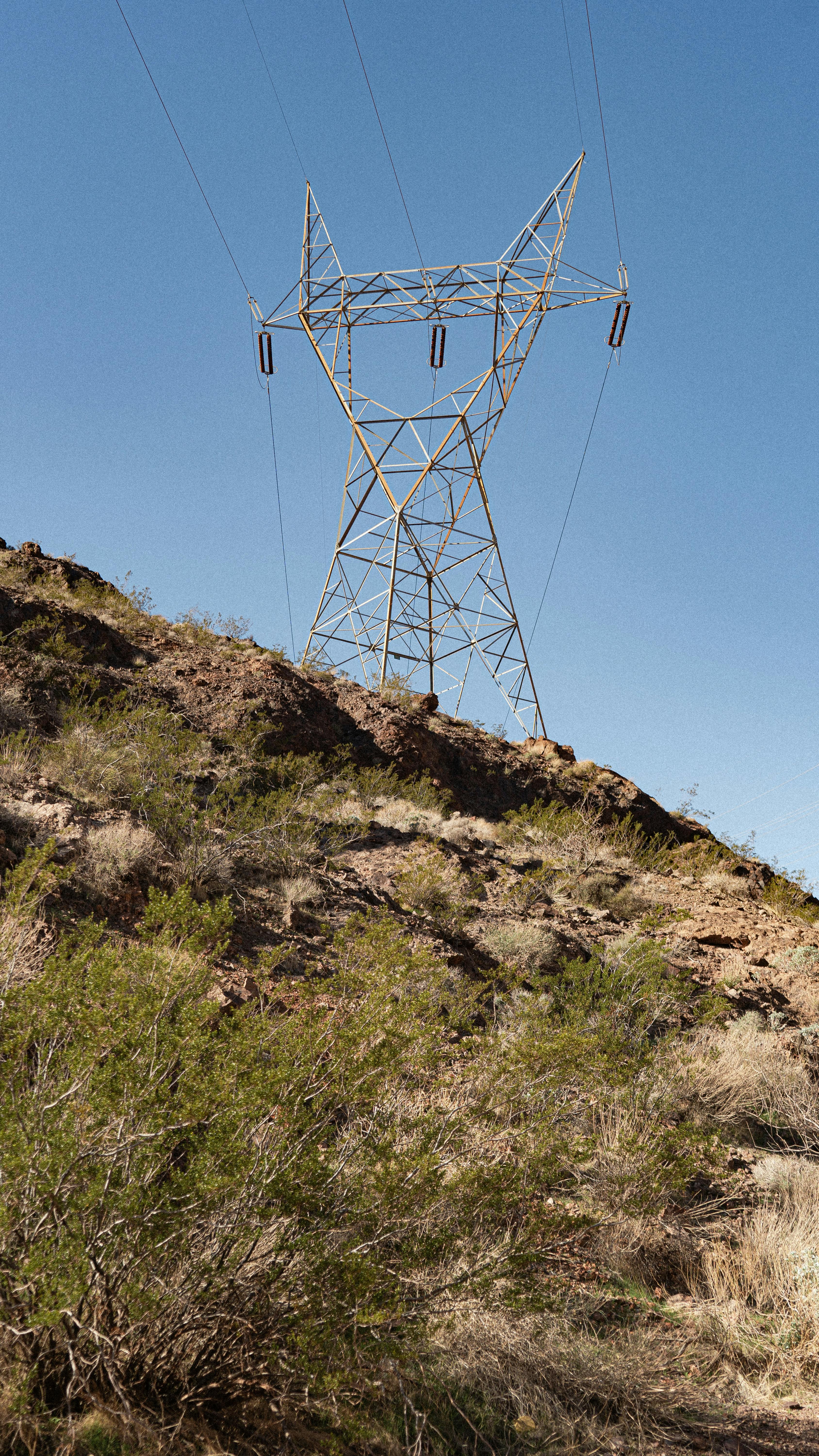 Gray Transmission Line Under Blue Sky at Daytime · Free Stock Photo