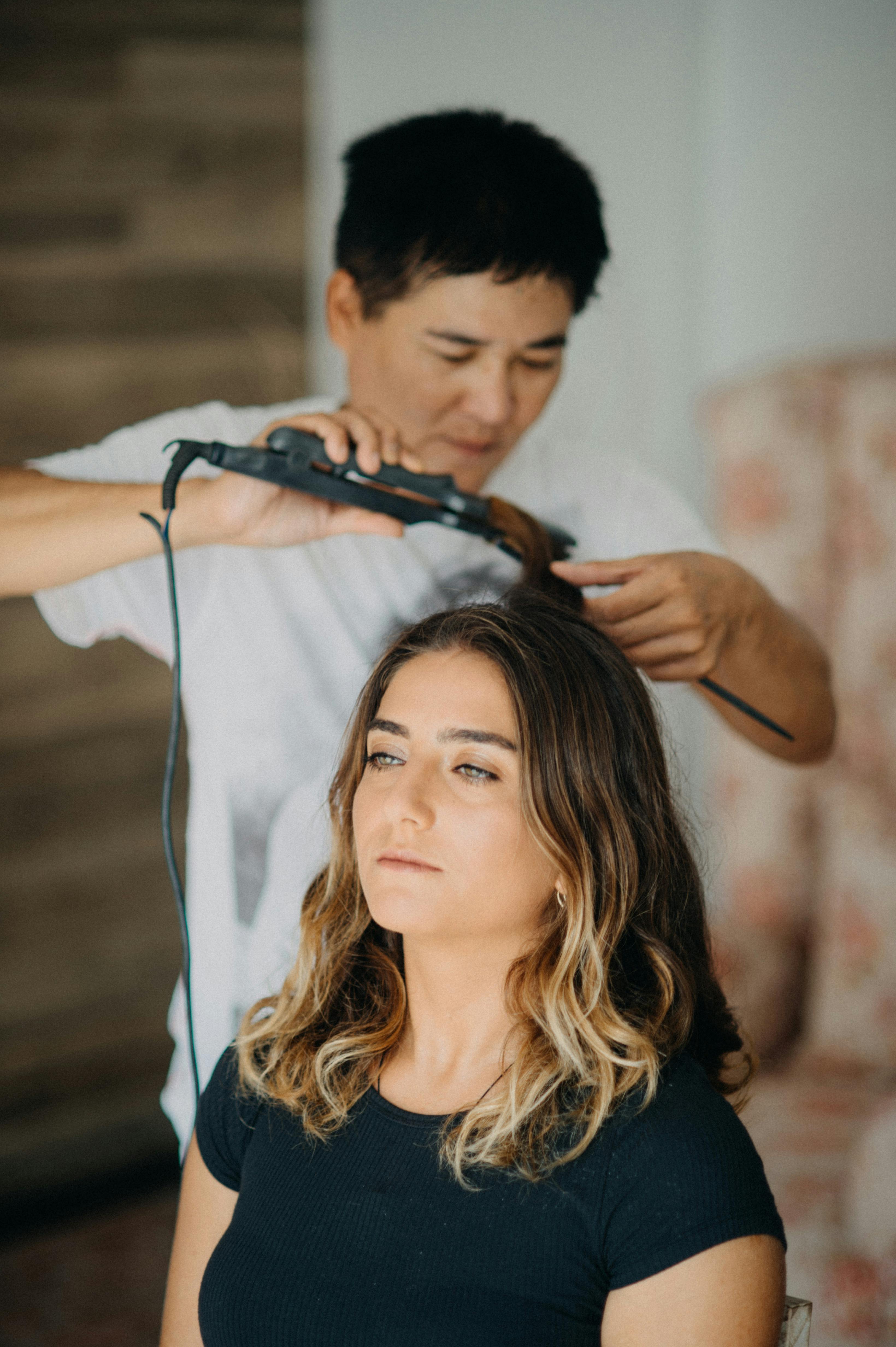 Woman Getting Her Hair Curled by a Hairdresser · Free Stock Photo
