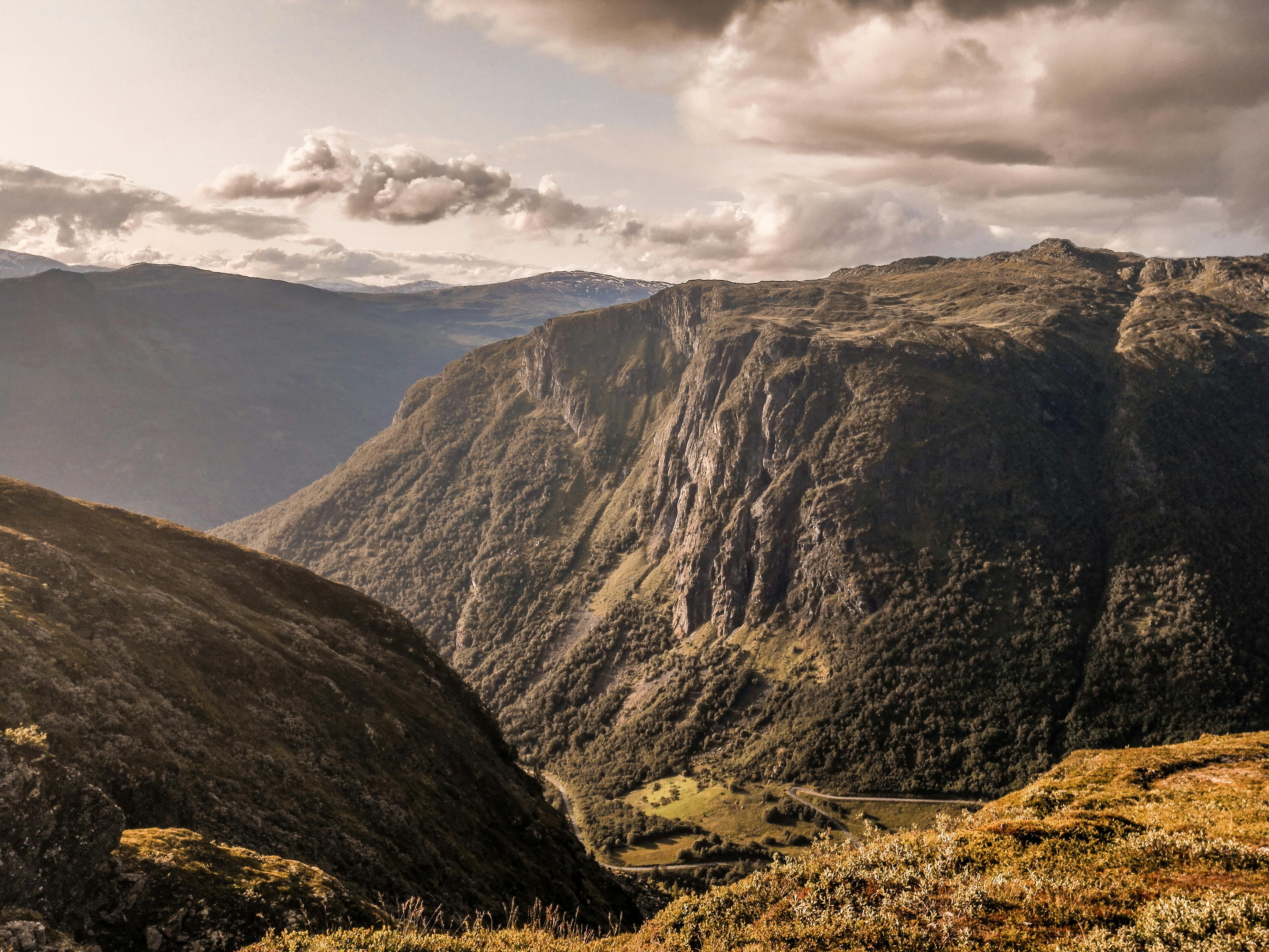 Valley among Steep Rocky Mountains · Free Stock Photo