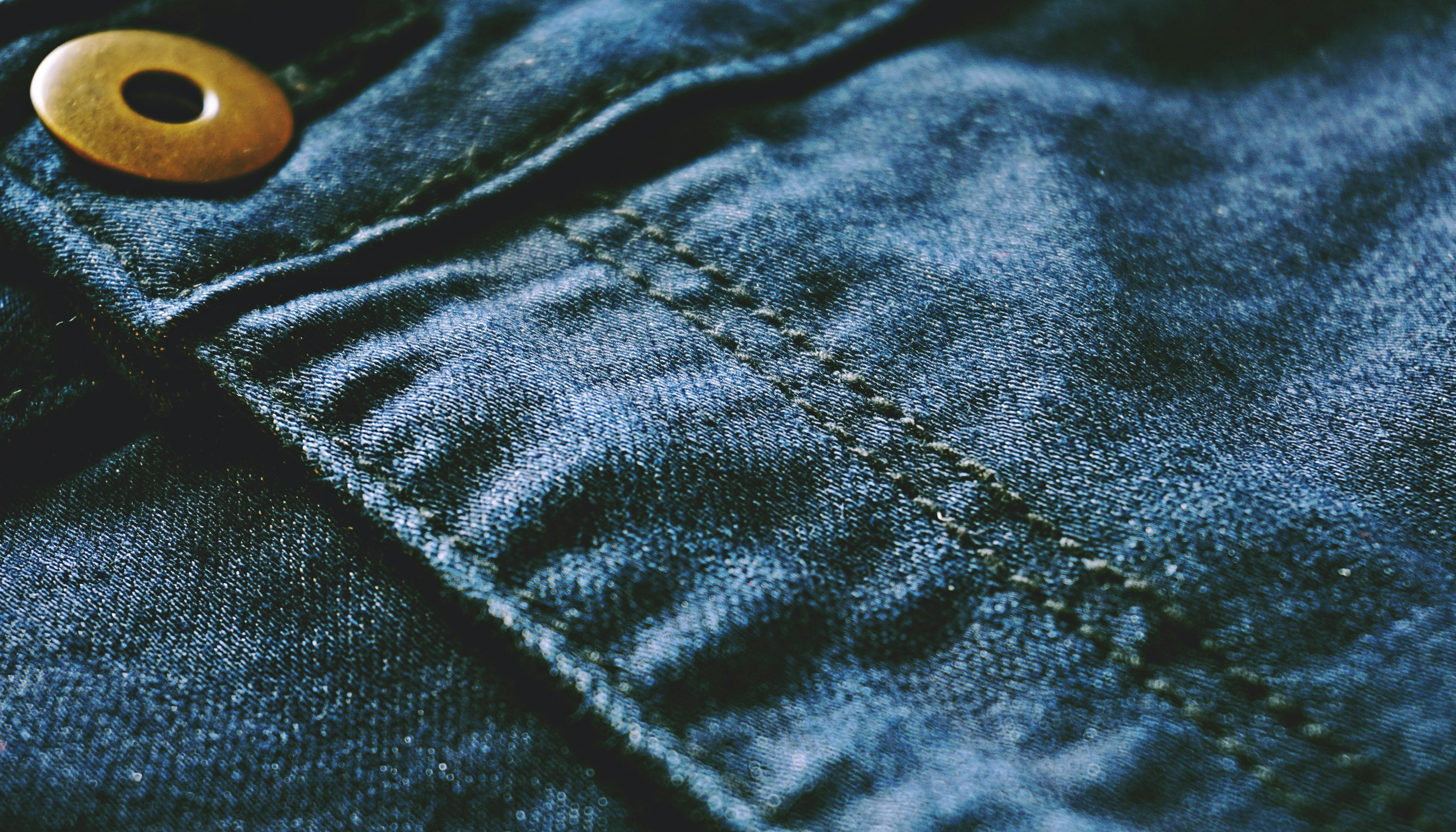 Blue Denim Textile With Brown Button · Free Stock Photo