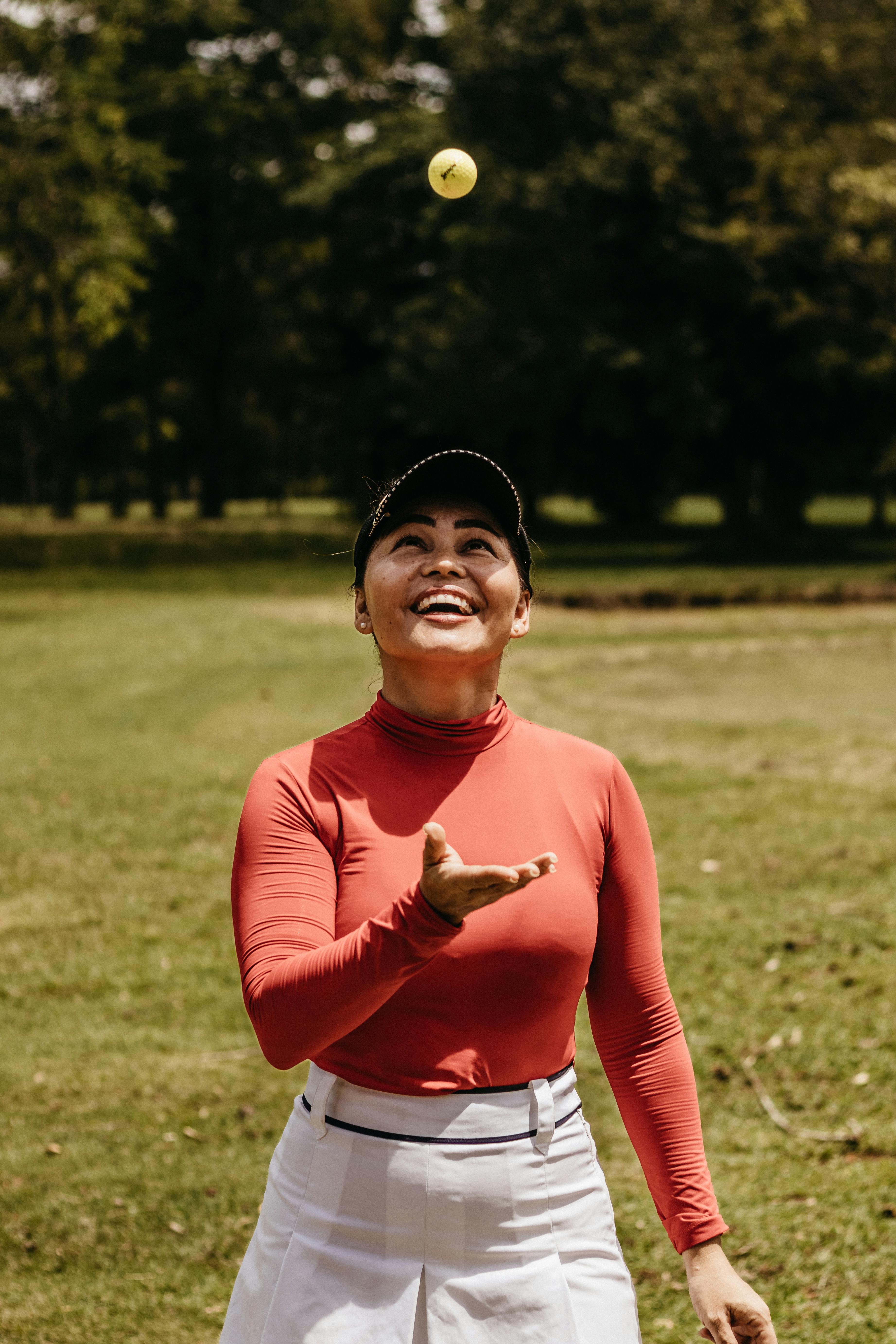 A Woman and a Girl Throwing a Ball · Free Stock Photo