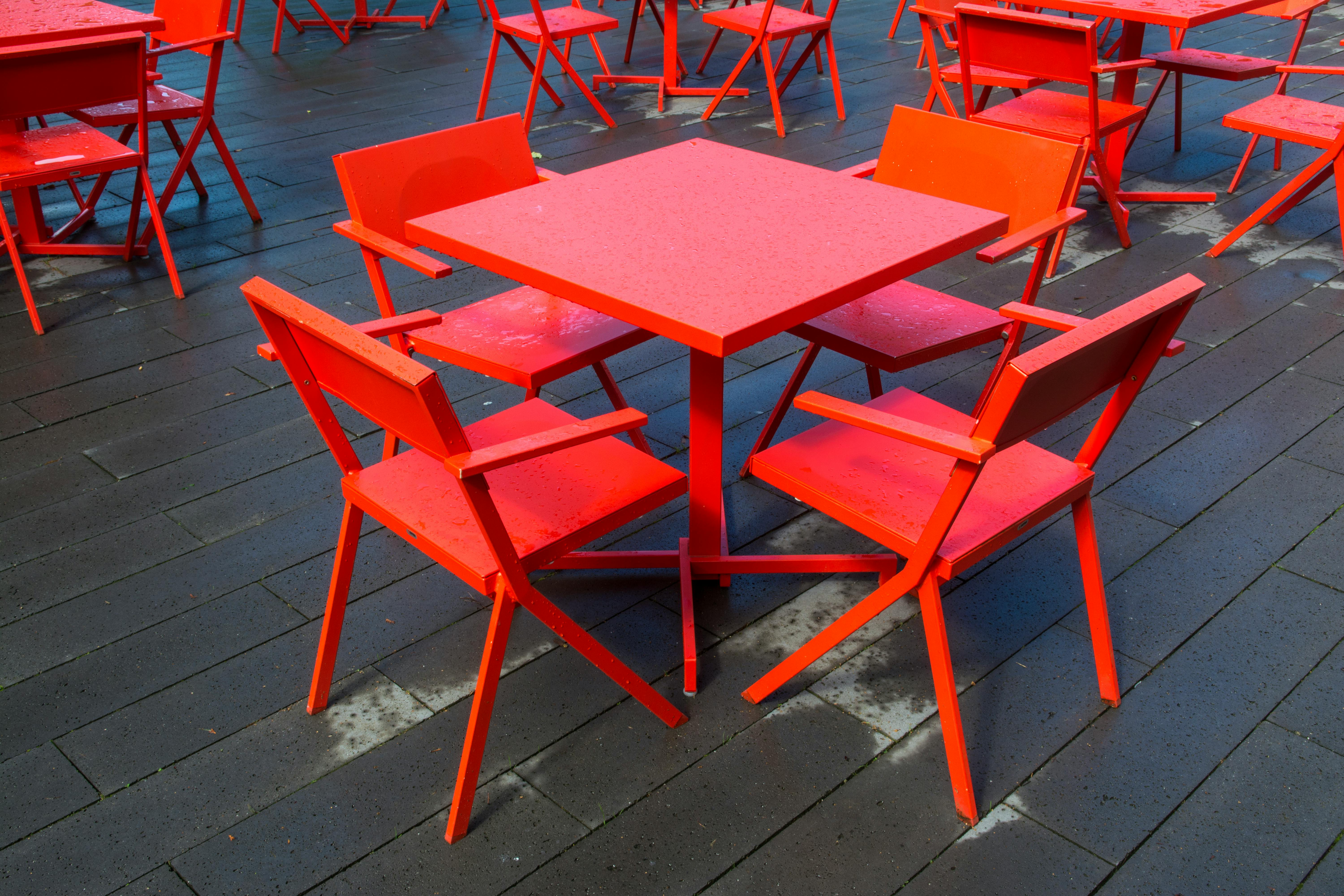 Red Tables and Chairs on a Terrace · Free Stock Photo