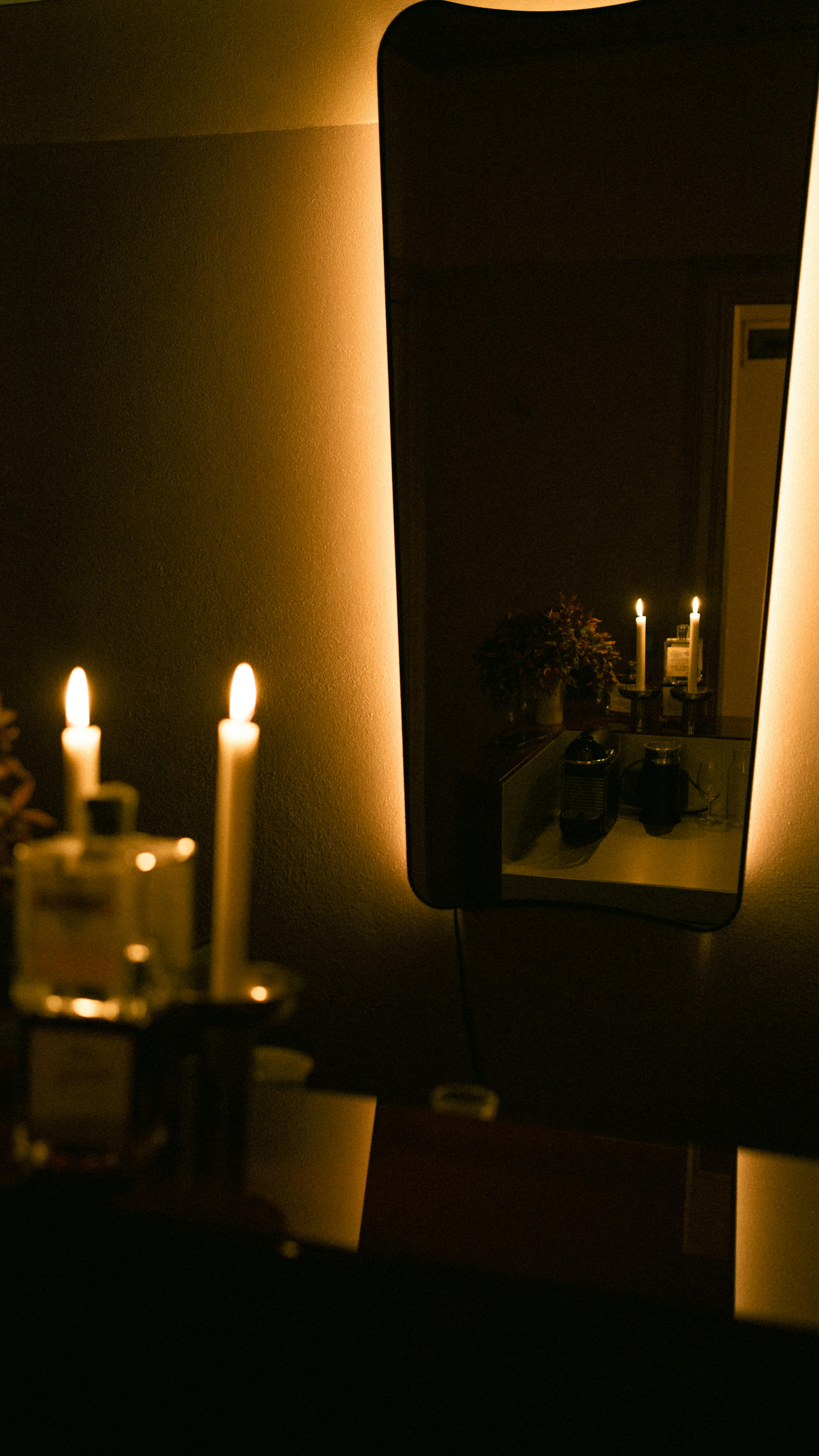 Photo of the Reflection of Candles and a Bouquet in a Mirror · Free ...